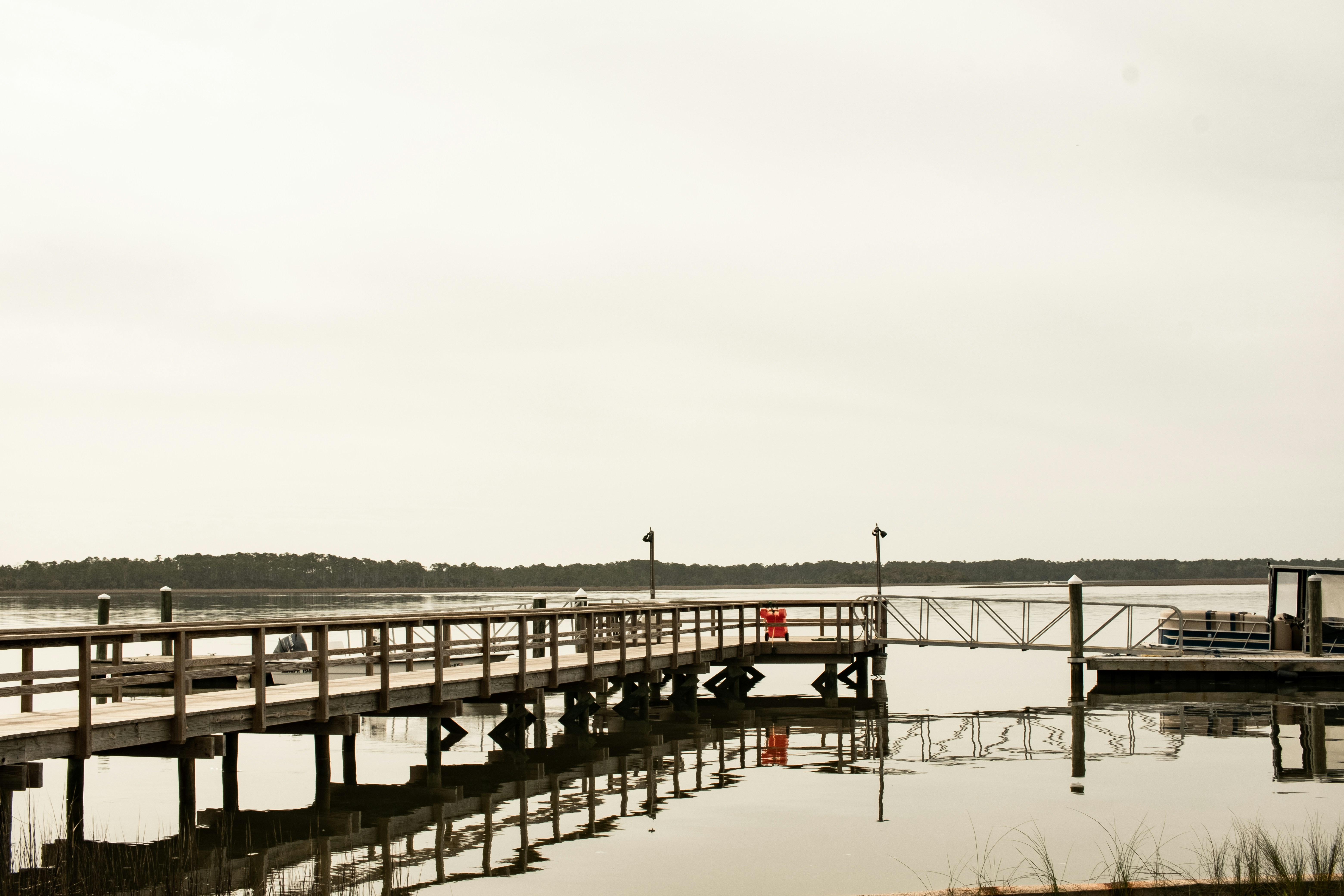 Brown wooden dock on body of water during daytime photo – Free Hilton ...