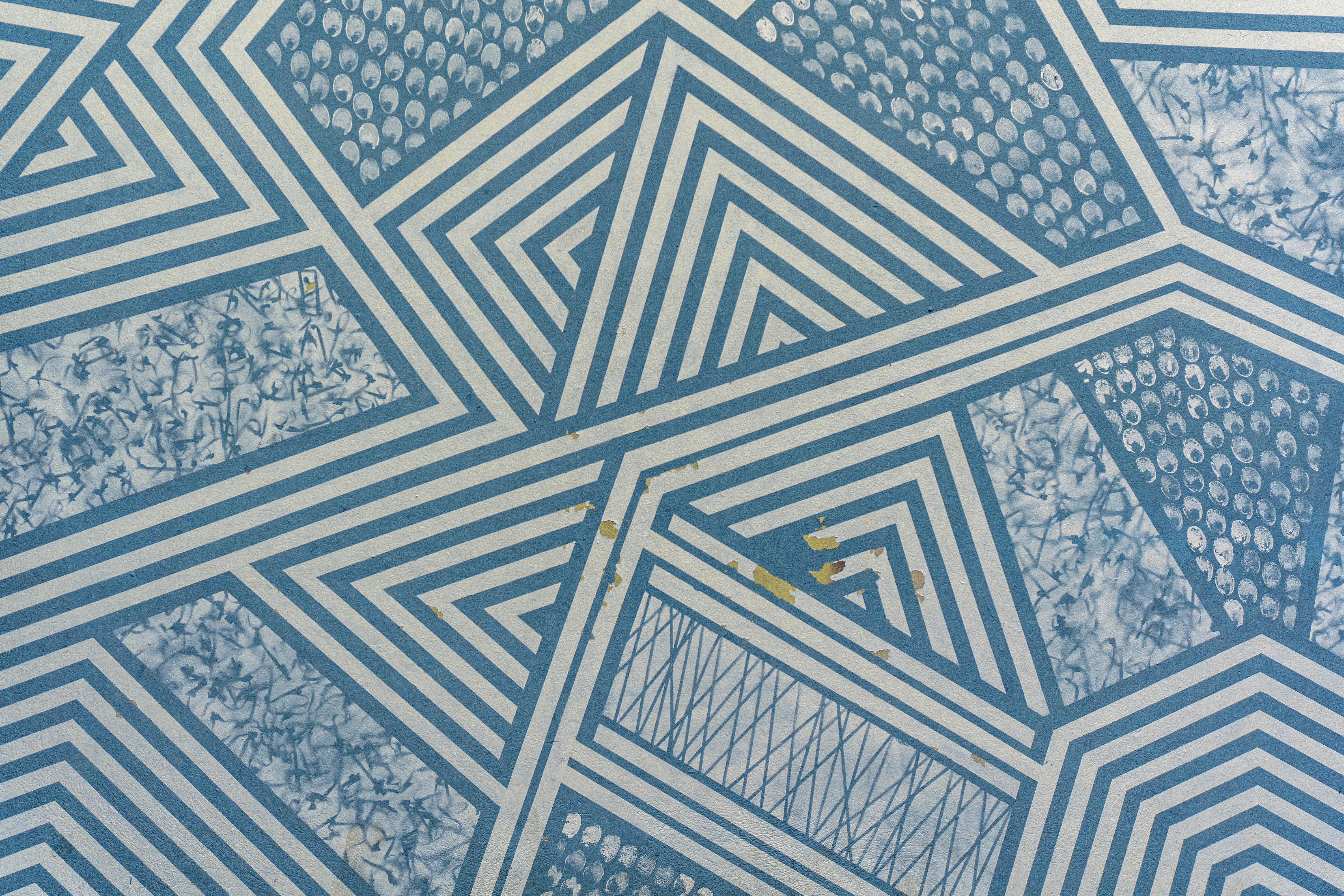 Blue Geometric Quilt: Interlocking Stripes and Diamonds