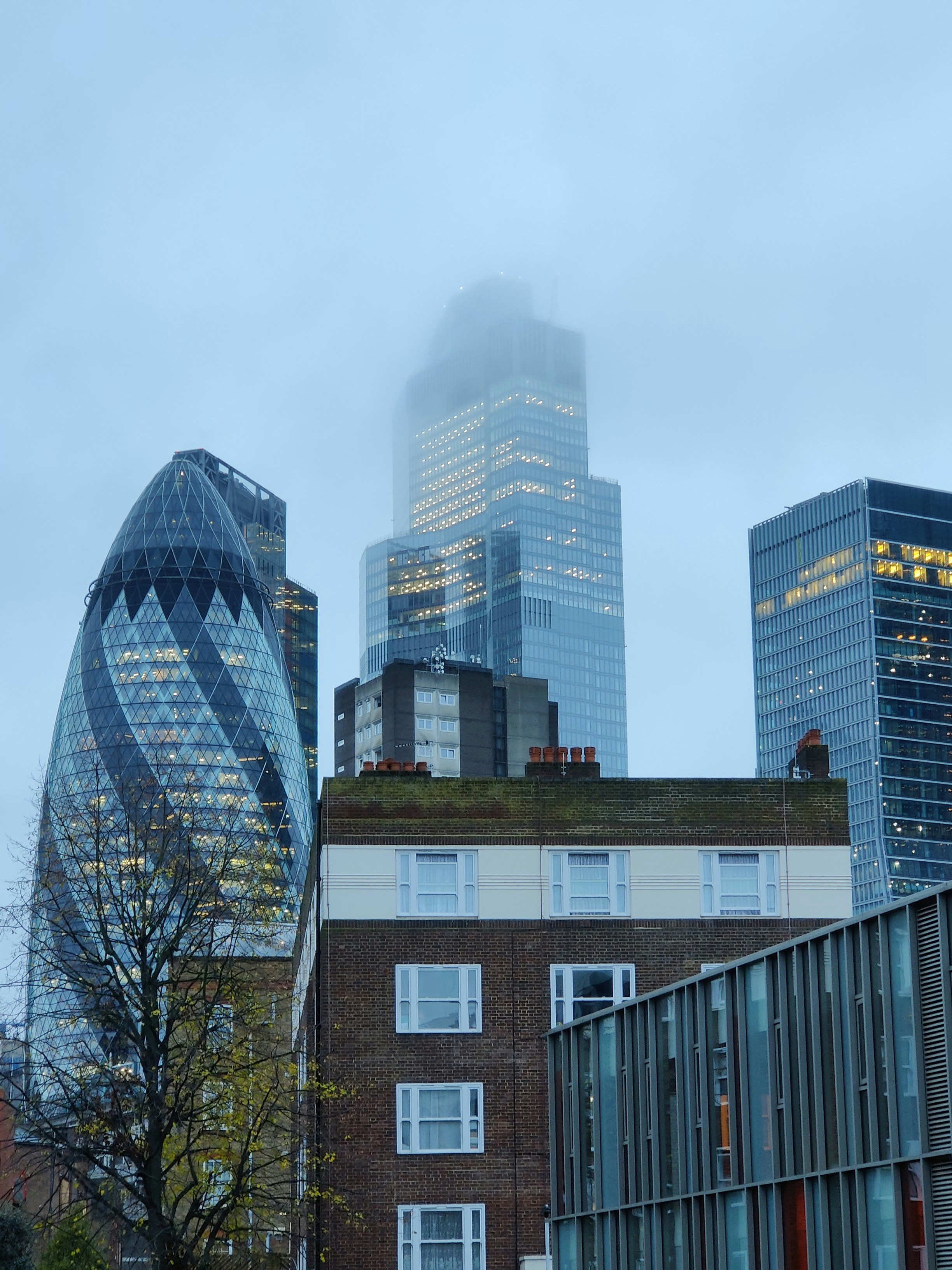 London gherkin | brown and white concrete building