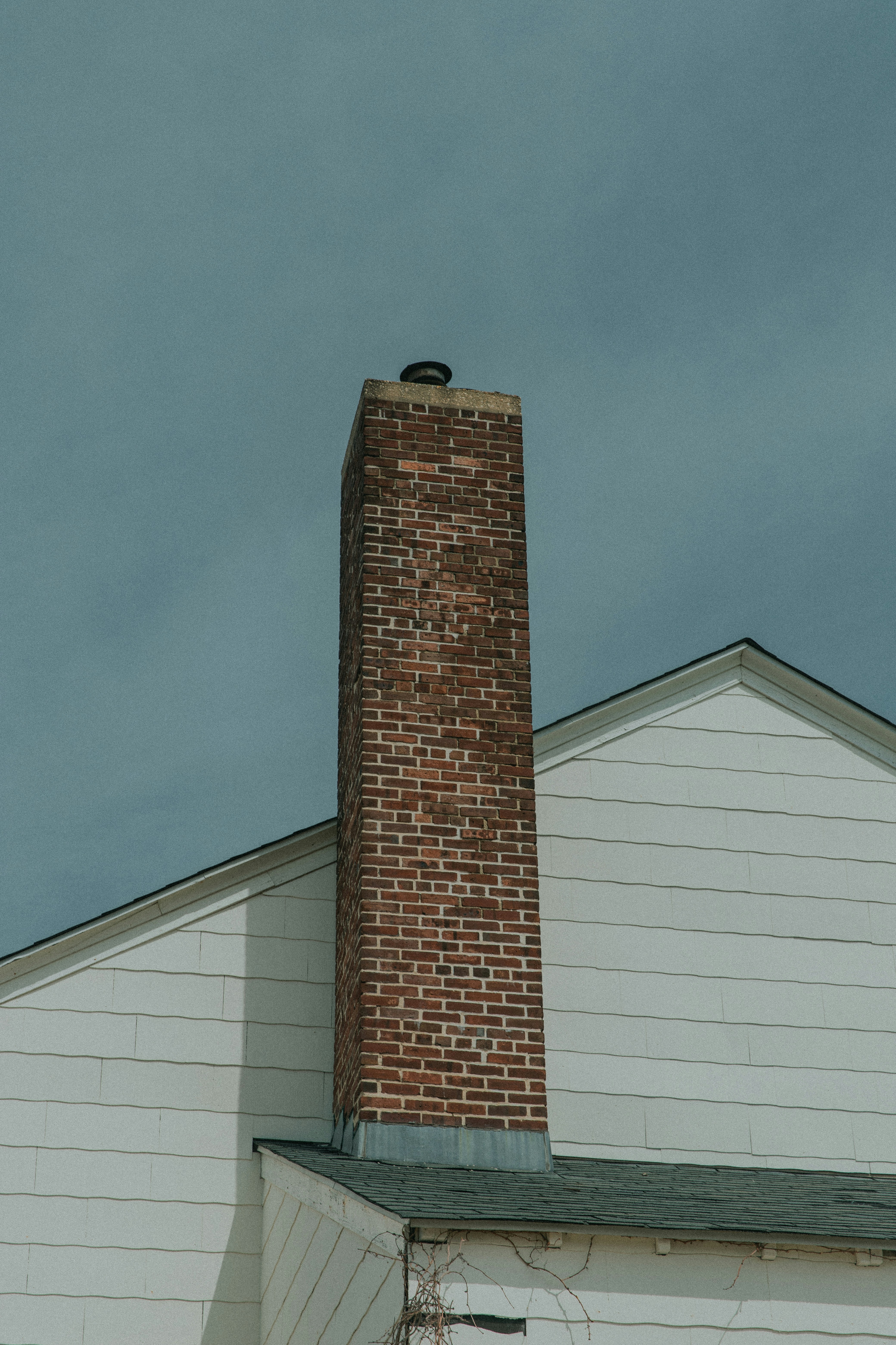brown brick wall under blue sky during daytime
