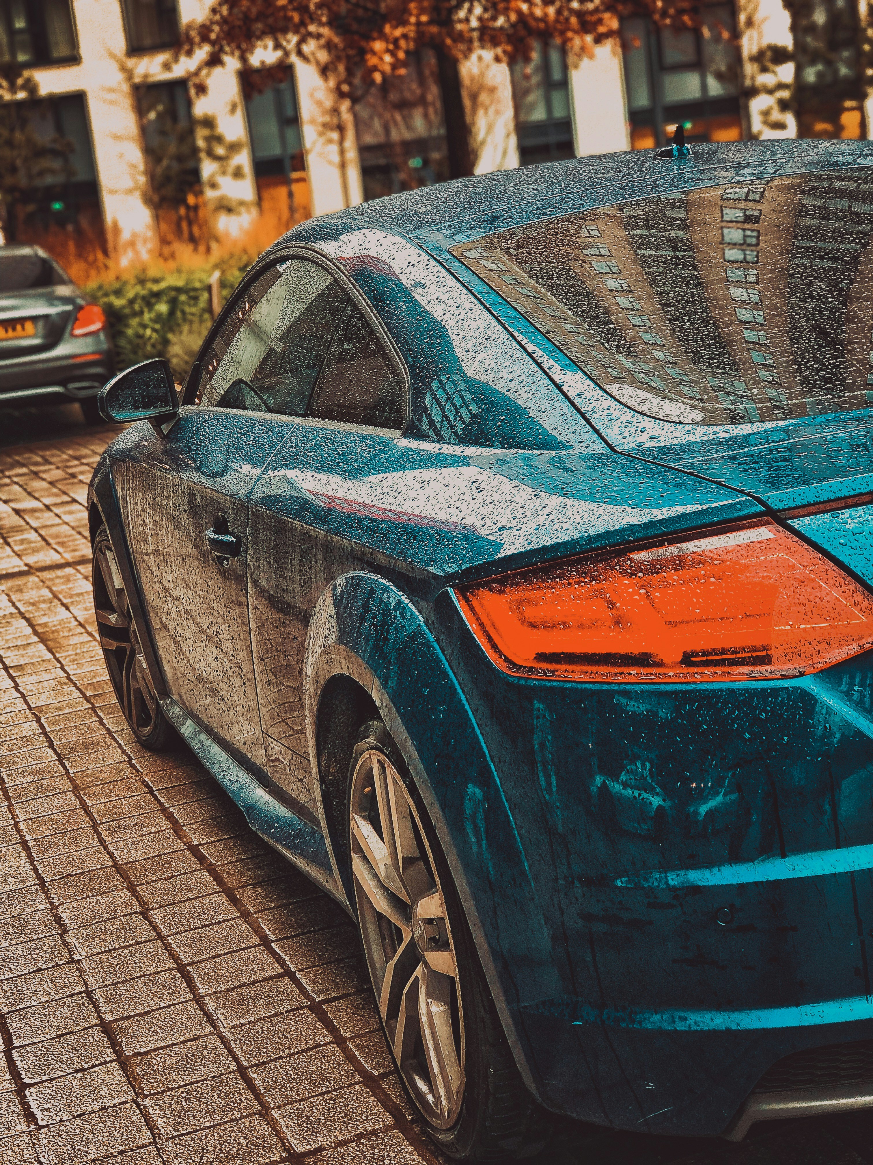 Racing Blue: Rain-Speckled Coupe Exudes Urban Night Heat
