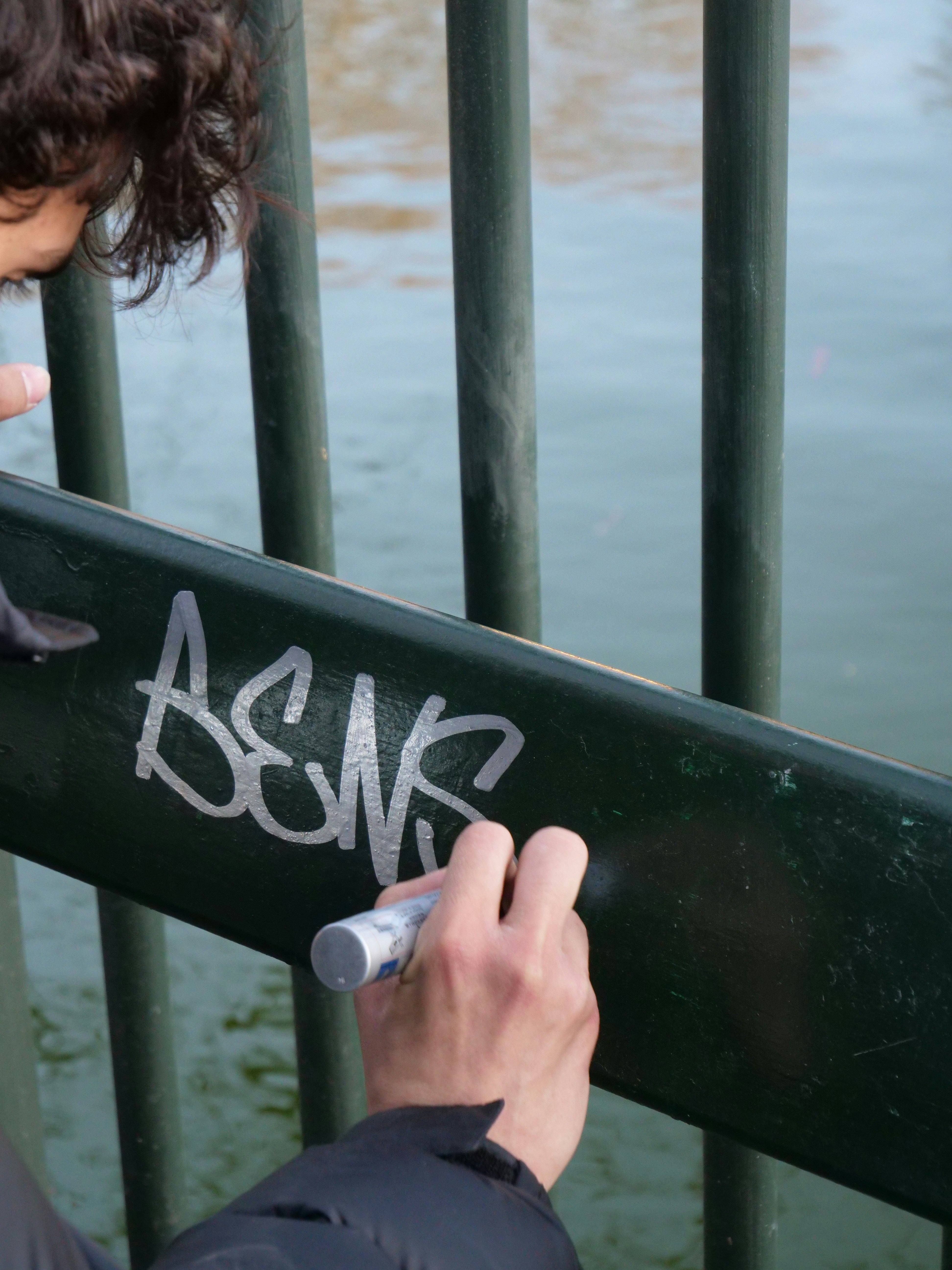 Graffiti Tagging at a Waterfront Barrier
