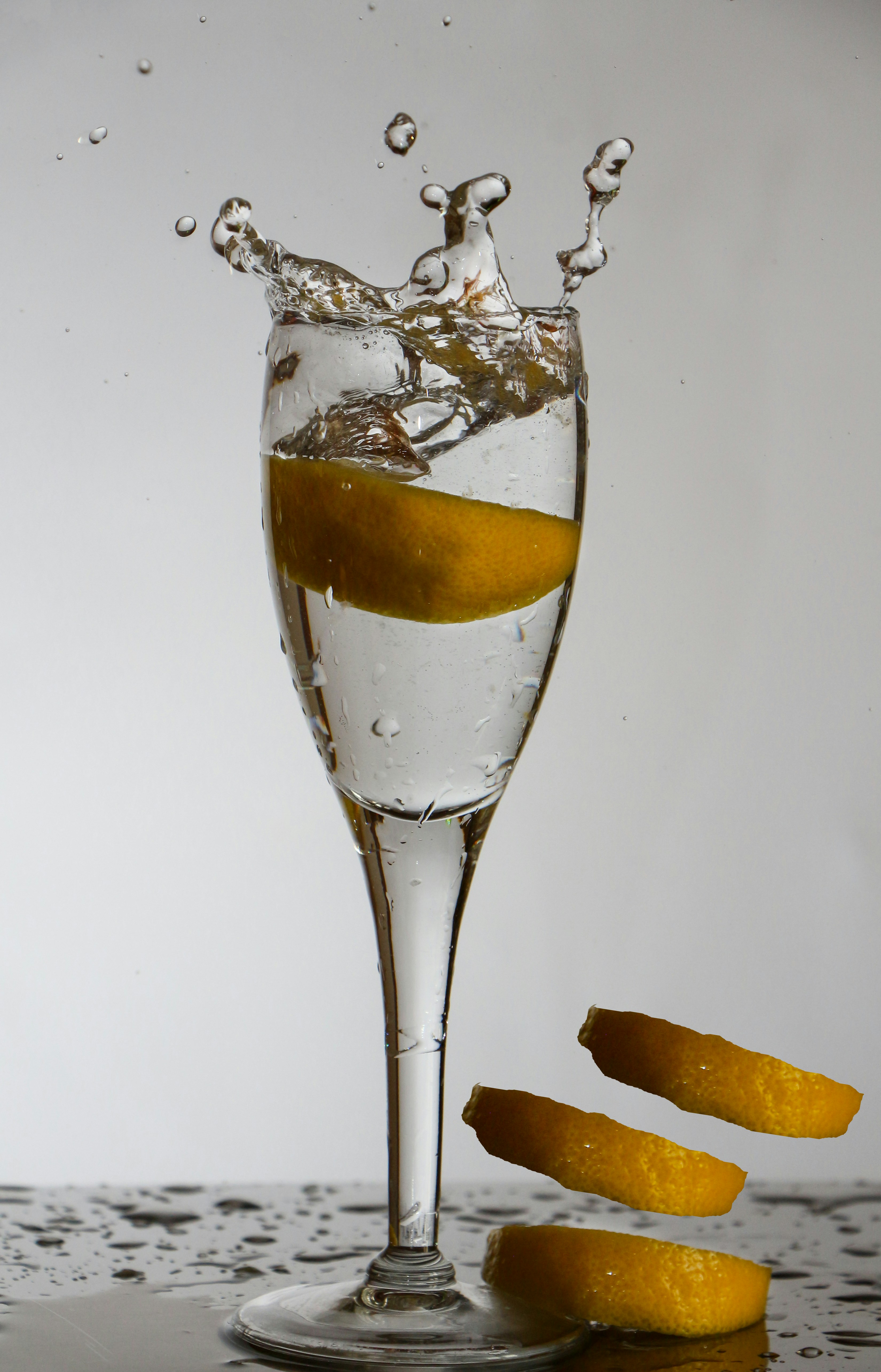 Citrus Crown: Champagne Splash Over a Crystal Glass