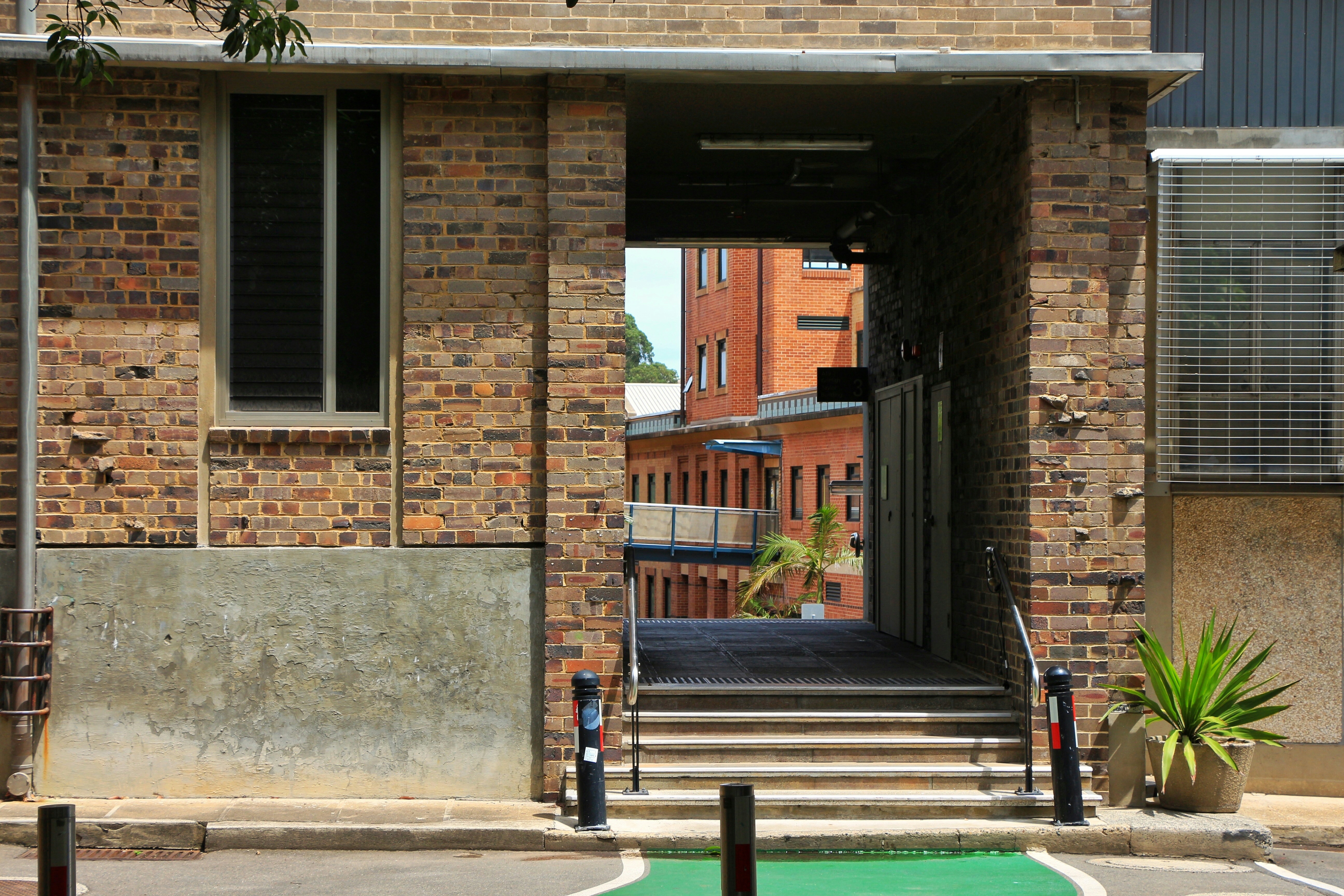 Brick Passageway Framing a Distant Courtyard