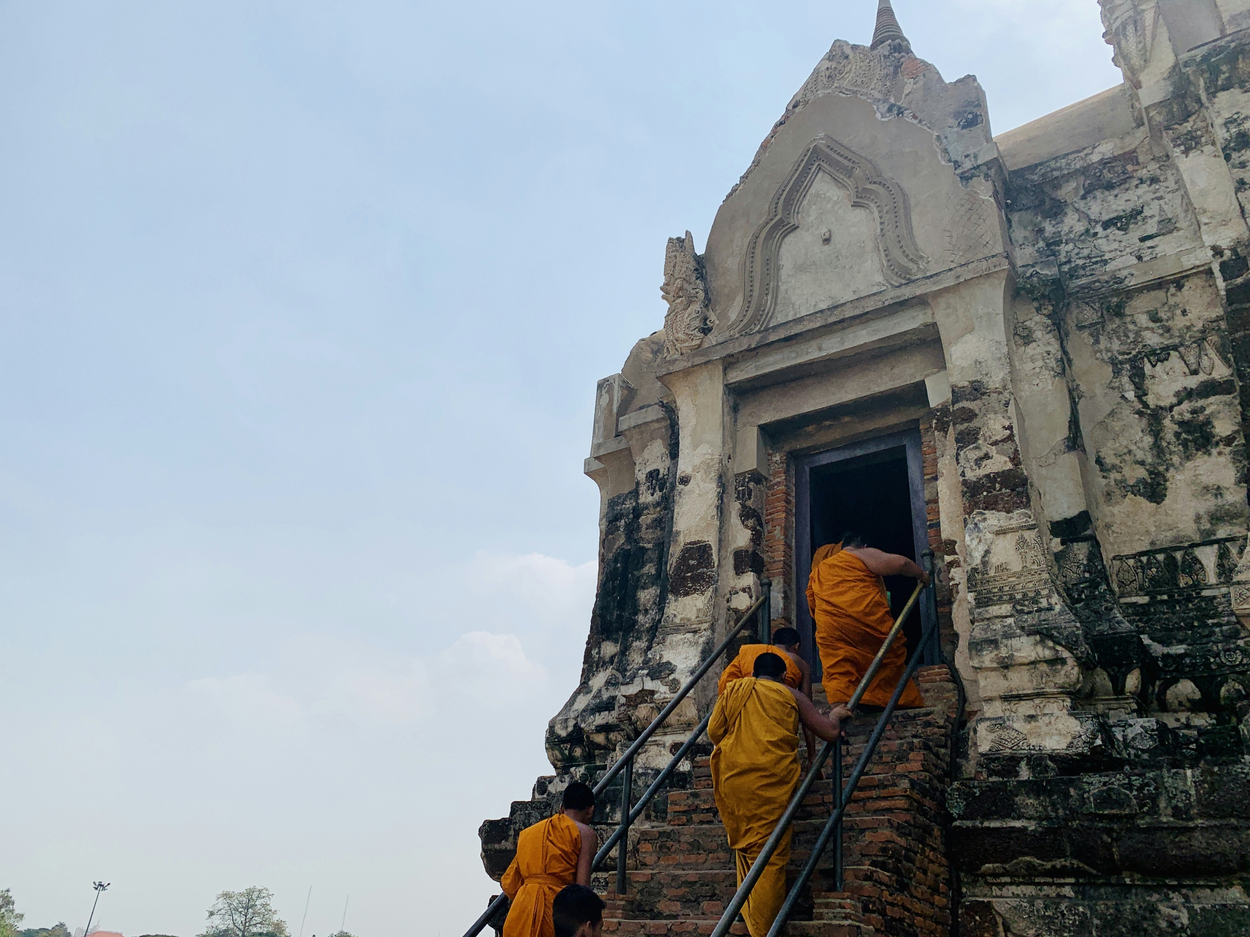 Saffron Steps: Climbing into a Weathered Temple Door