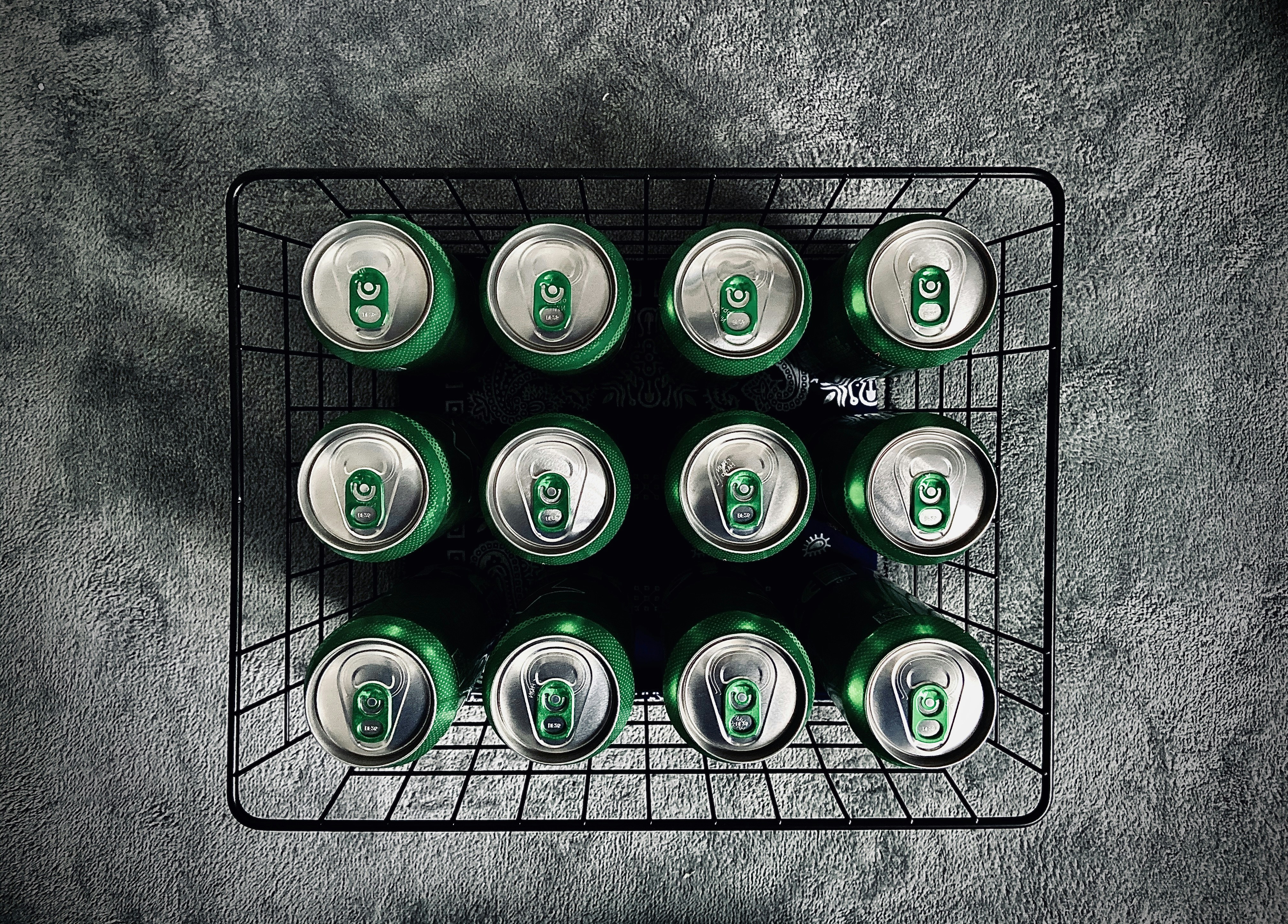 Top-Down Recovery: A Grid of Green Cans in a Metal Basket