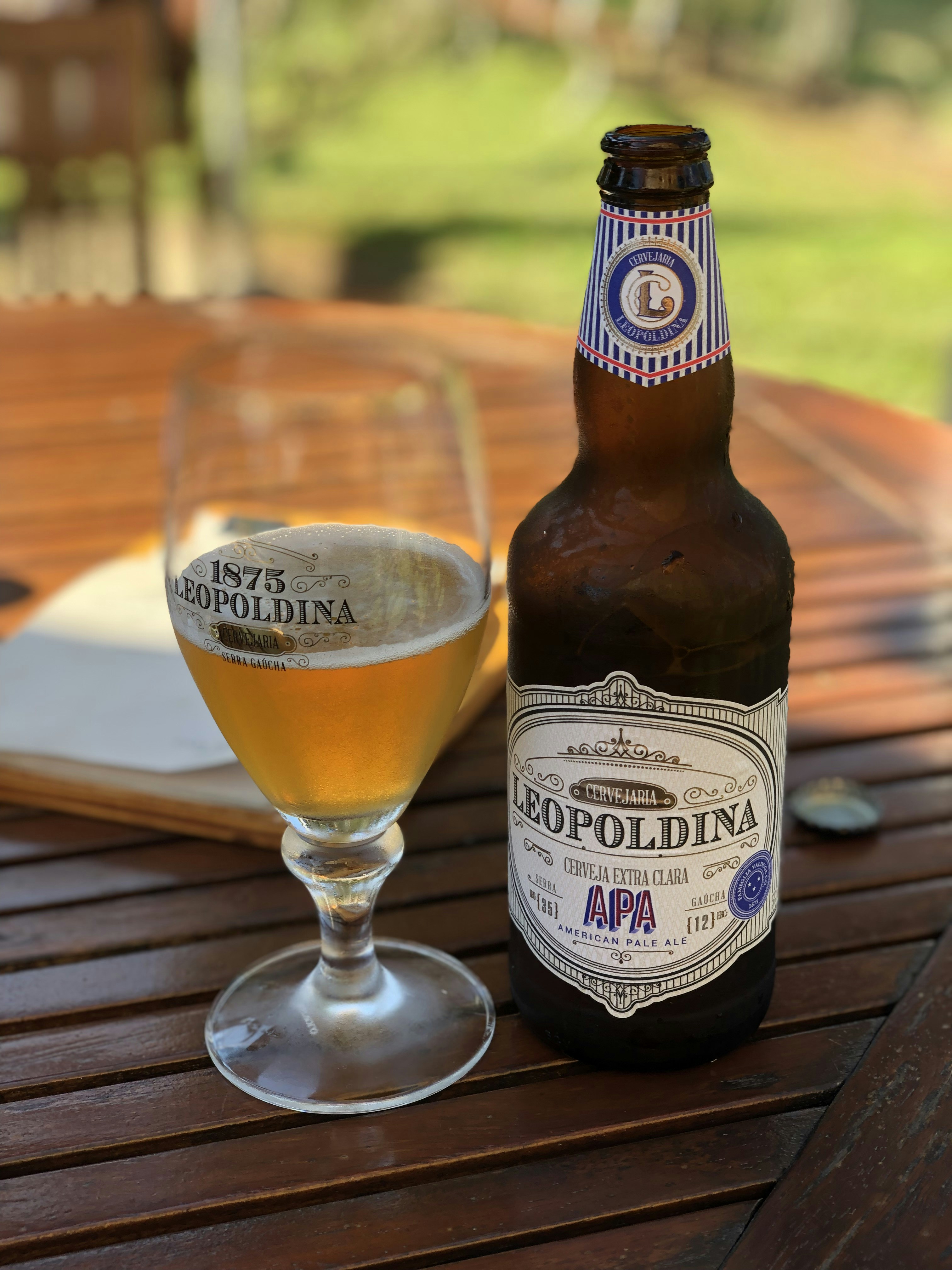 Patio Pour: Leopoldina APA Glow on a Sunlit Wood Table