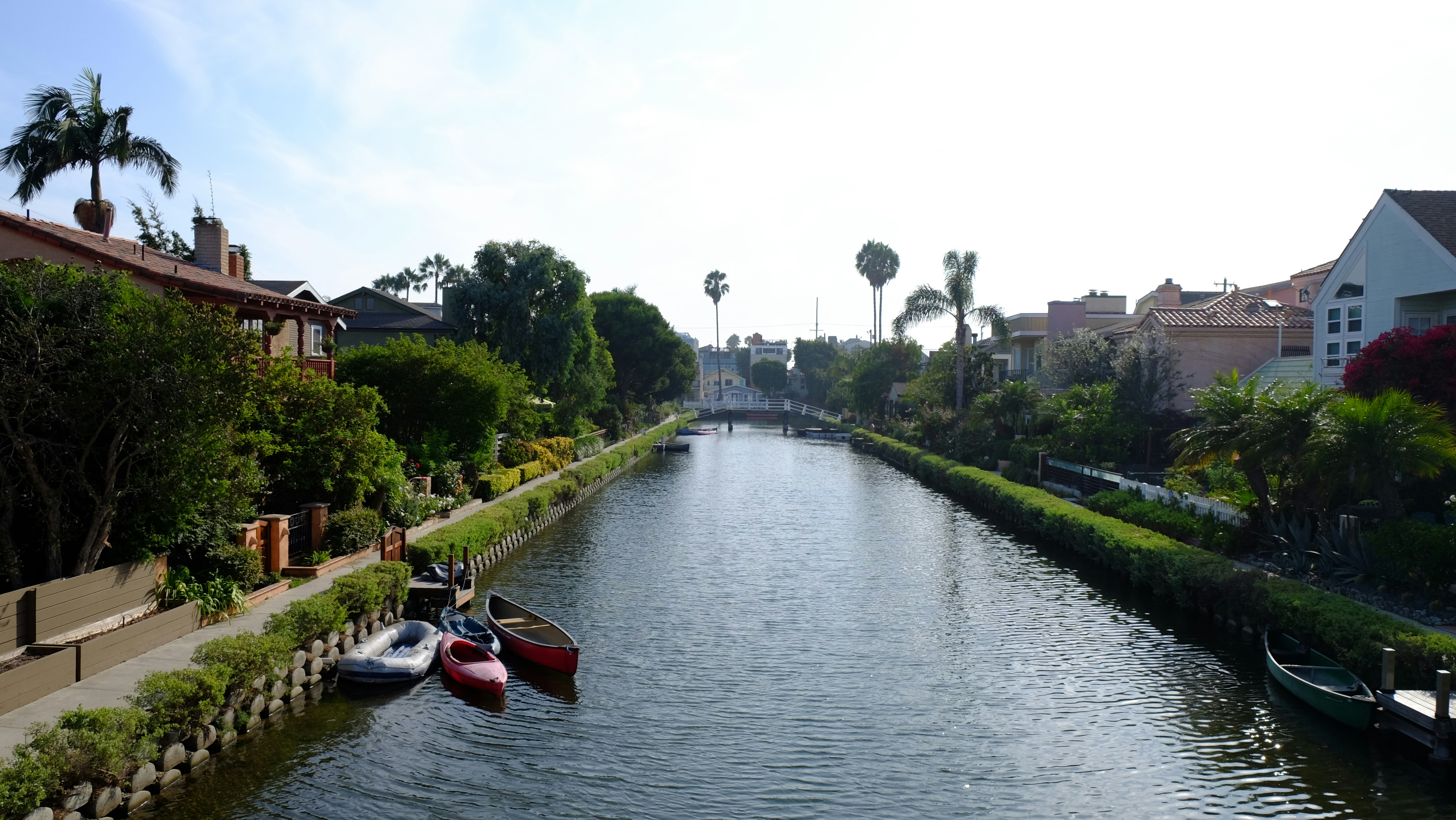 venice canal | red and white boat on river during daytime