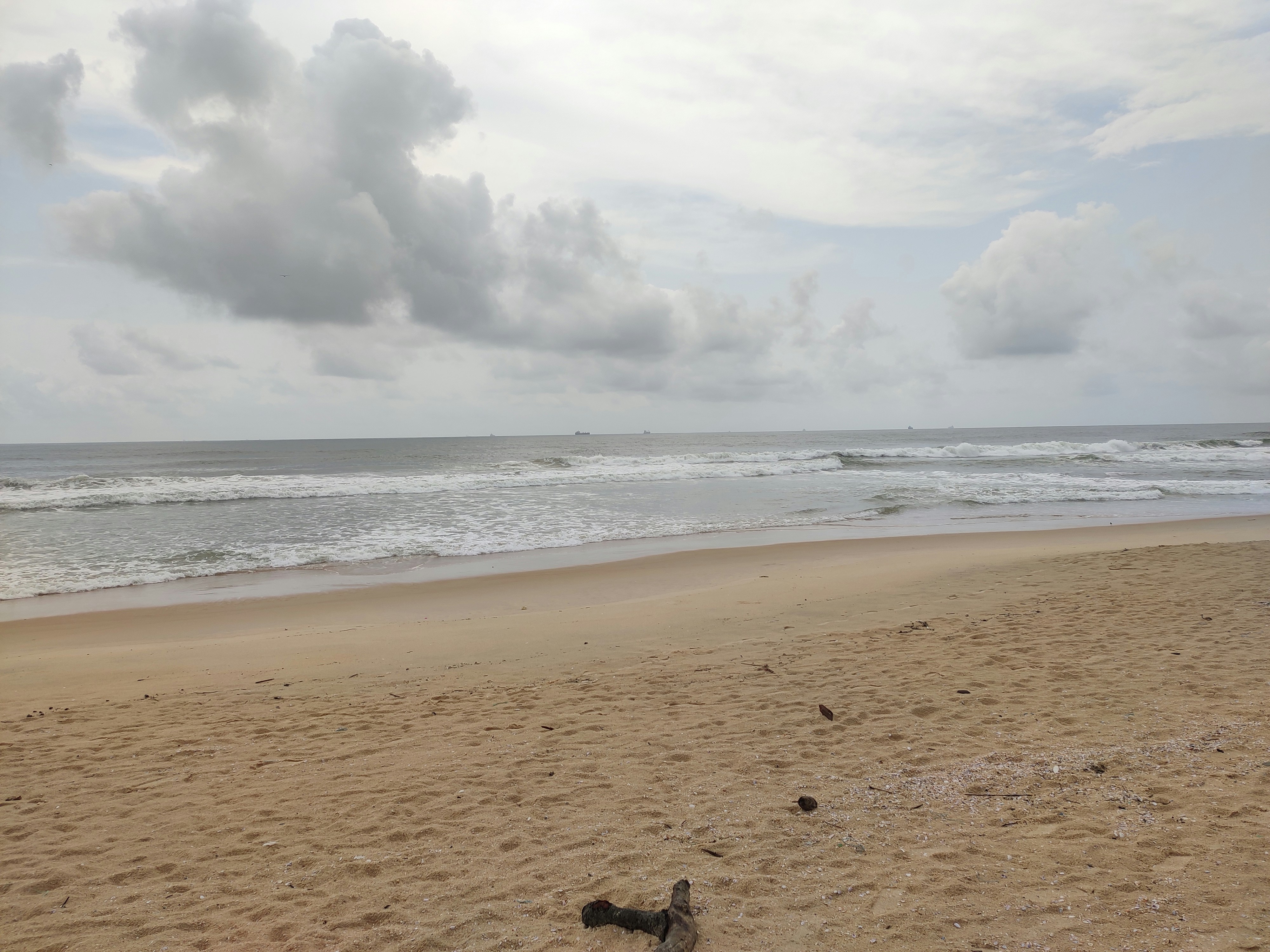 #Beach, #Sand, #Sea, #Panambur Beach, #India, #Sky | brown sand near body of water during daytime