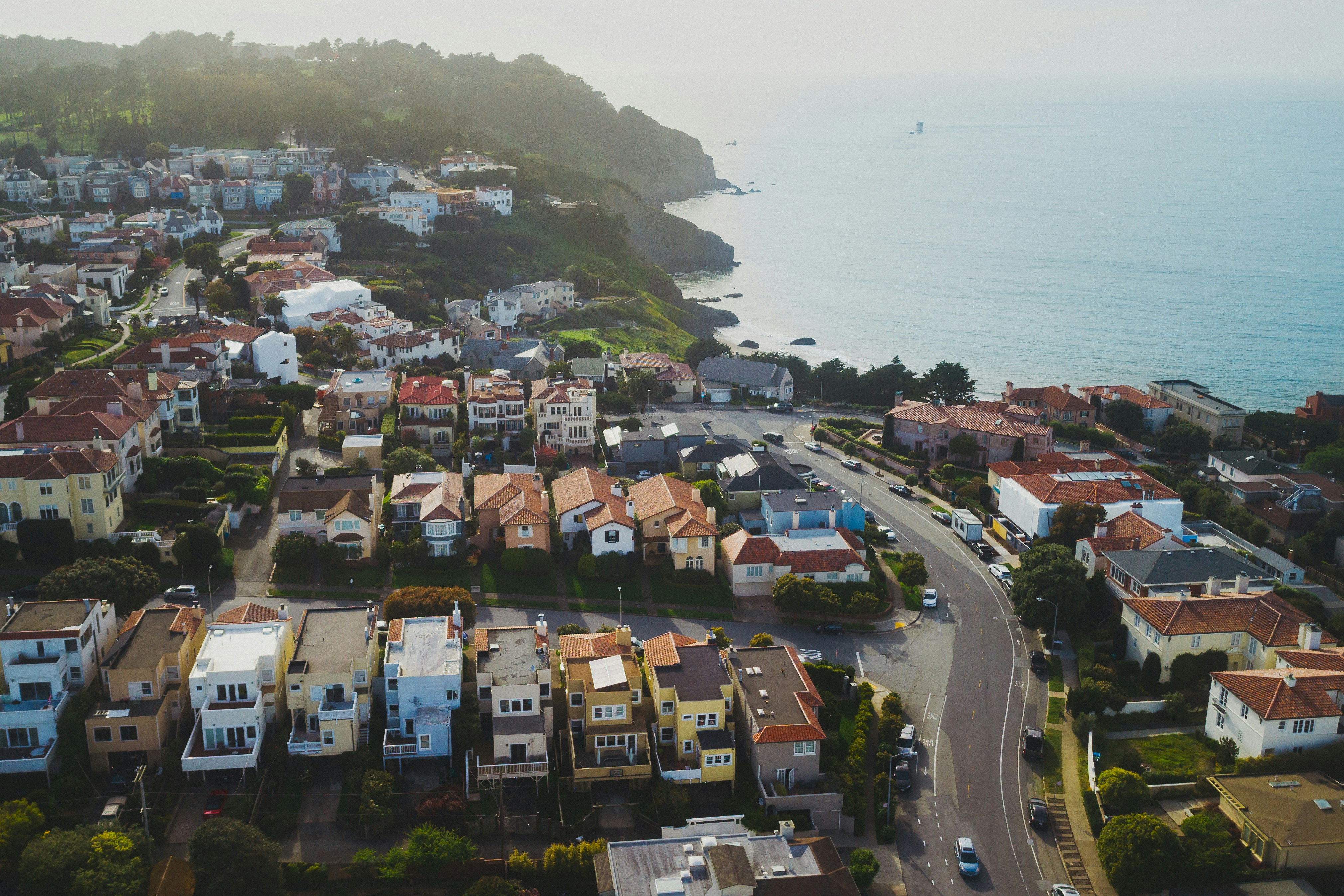 aerial view of city near body of water during daytime