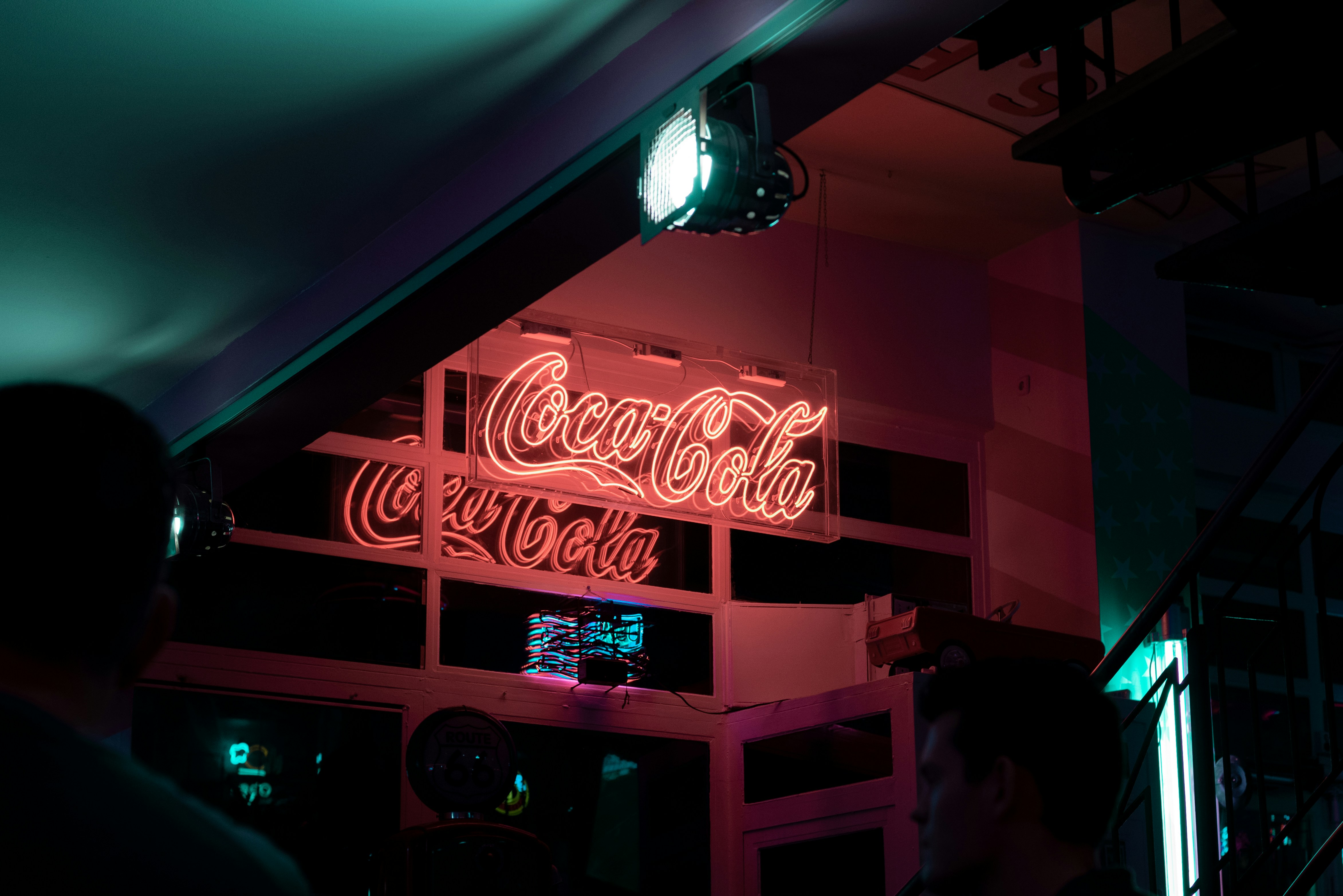 Coca-Cola Neon Glow Between Teal and Magenta Club Lights