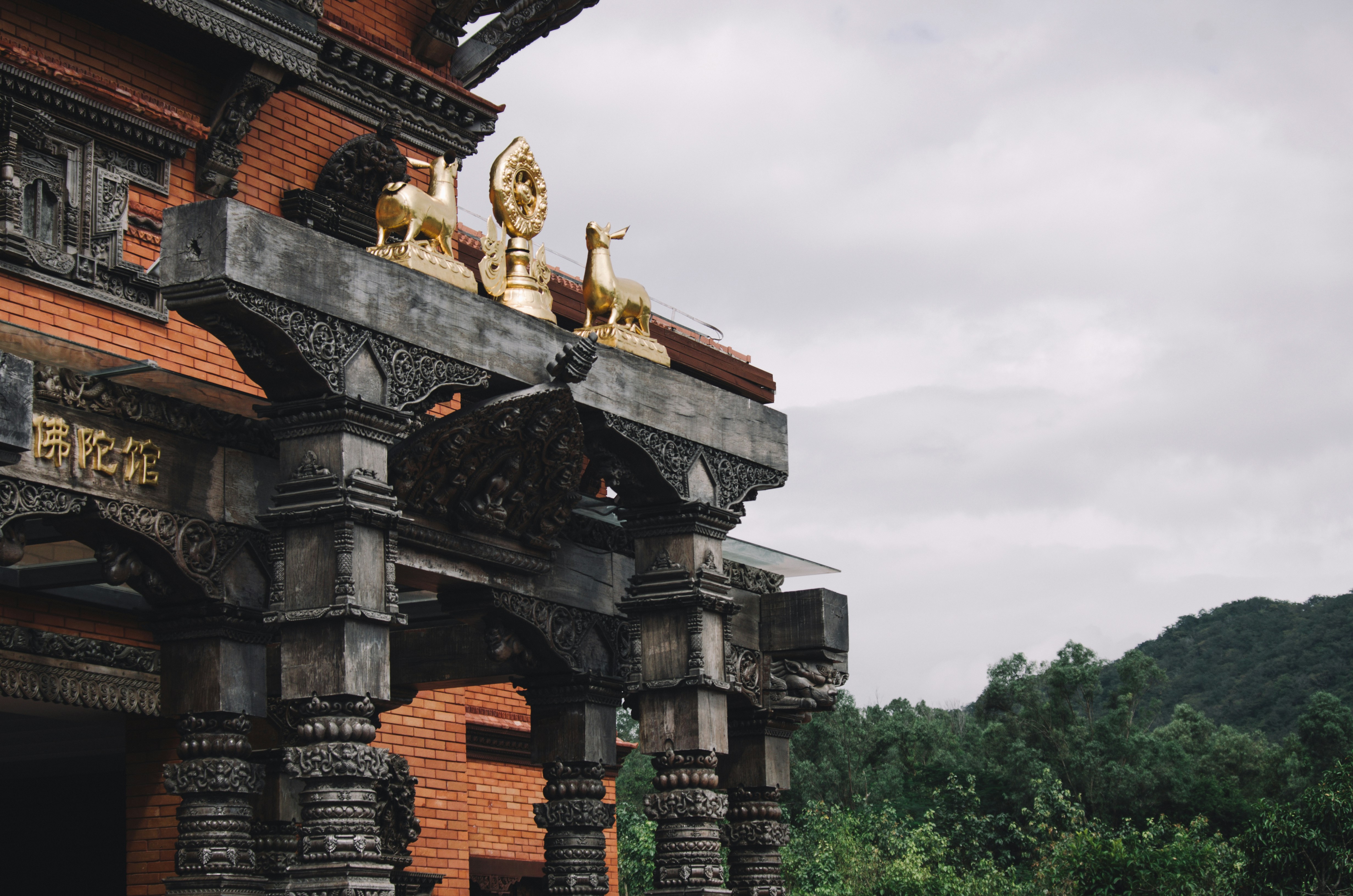 Ornate Thai-inspired Temple Façade Beneath Overcast Skies