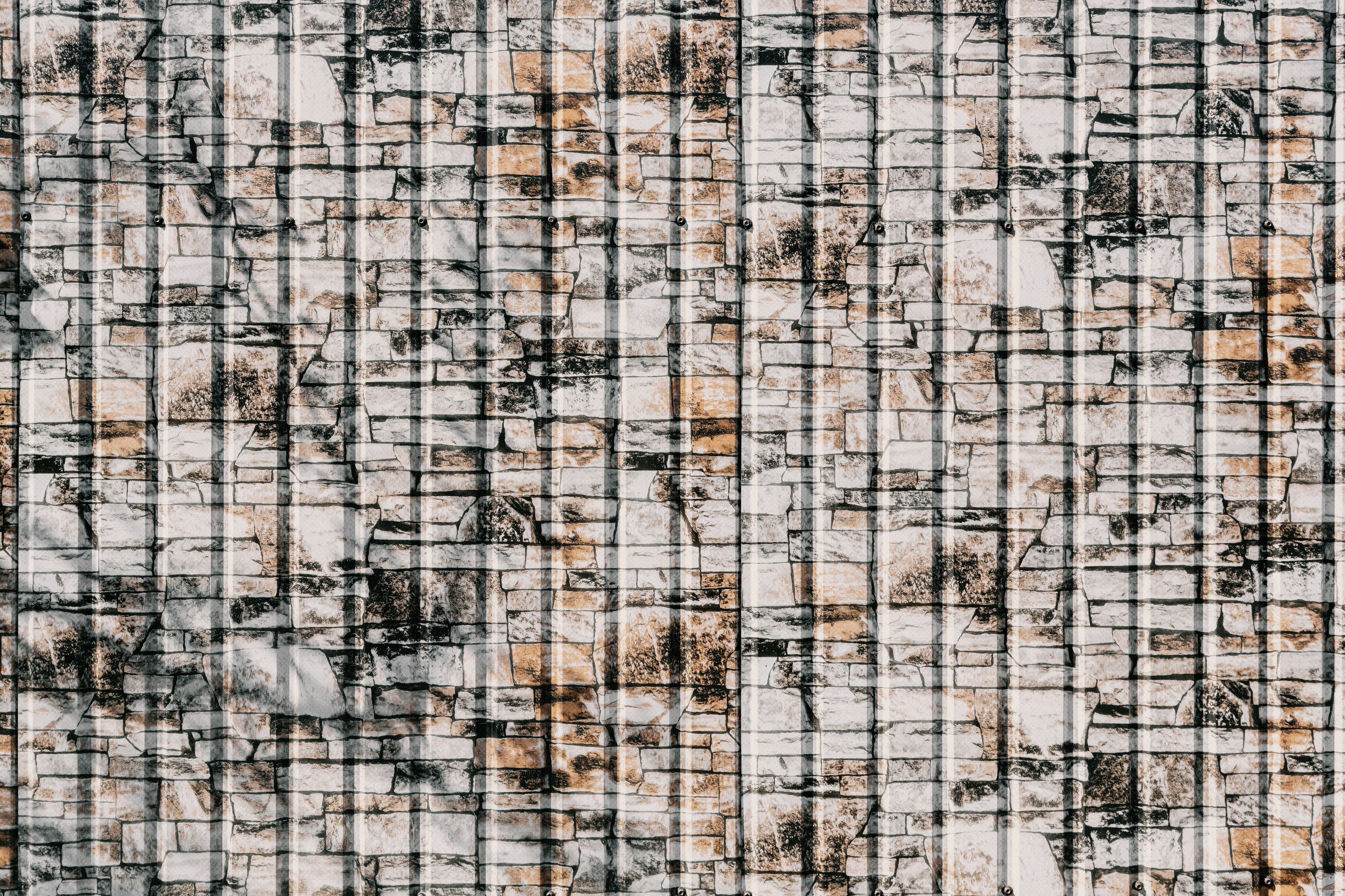 Intricate patterns of light and shadow interweave across a textured surface, showcasing a blend of natural and man-made elements.