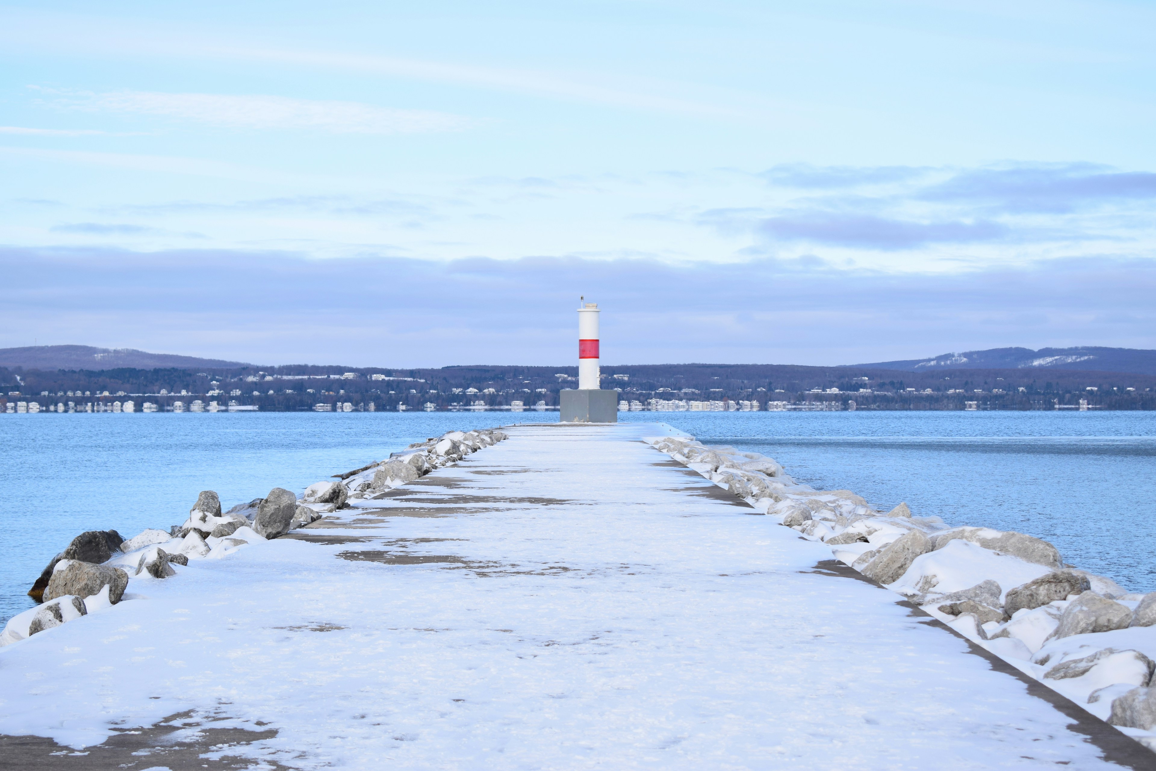 White and red lighthouse on gray concrete dock during daytime photo ...