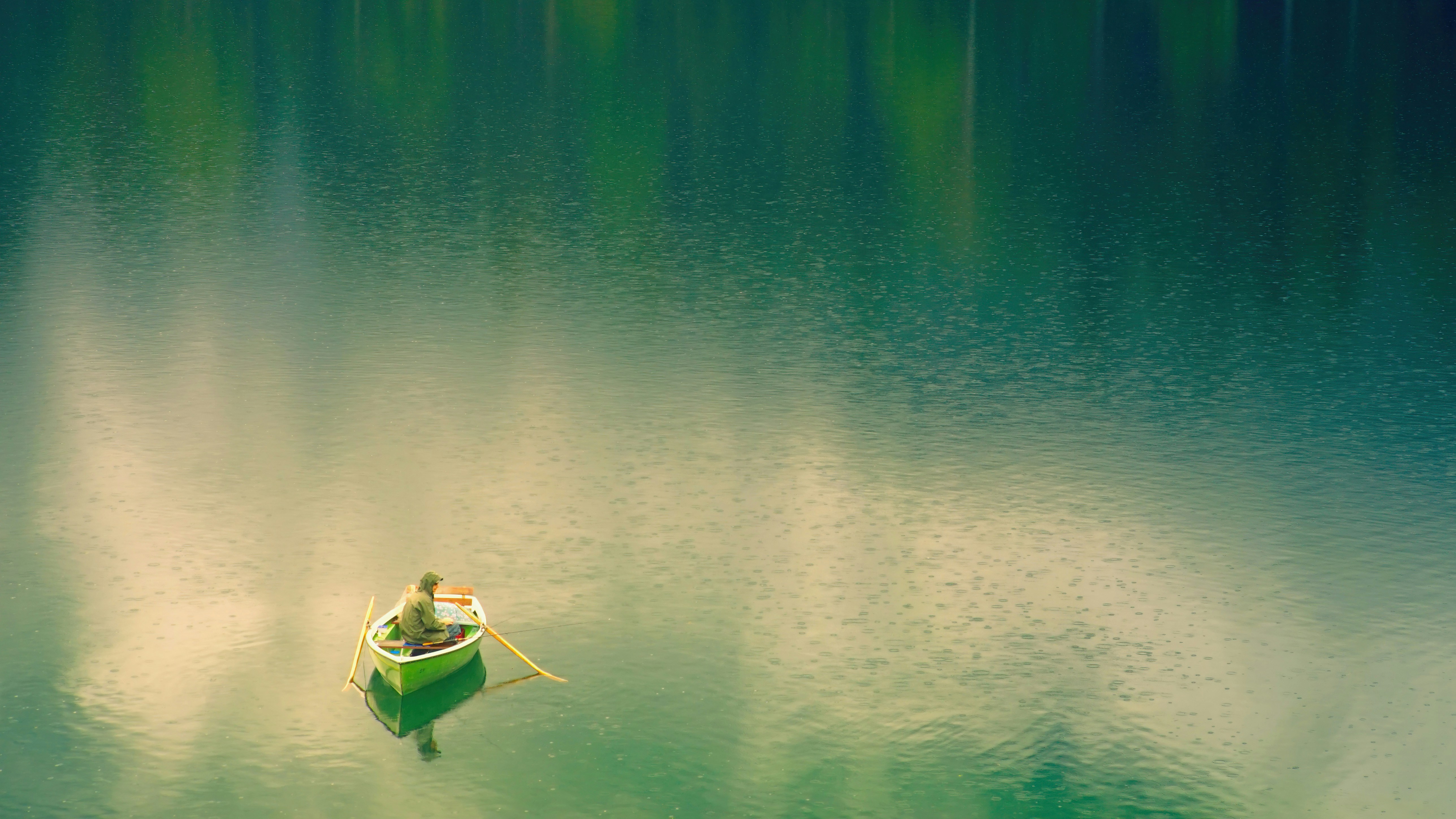 Green Boat, Quiet Mirror: A Solitary Row on Quiet Water