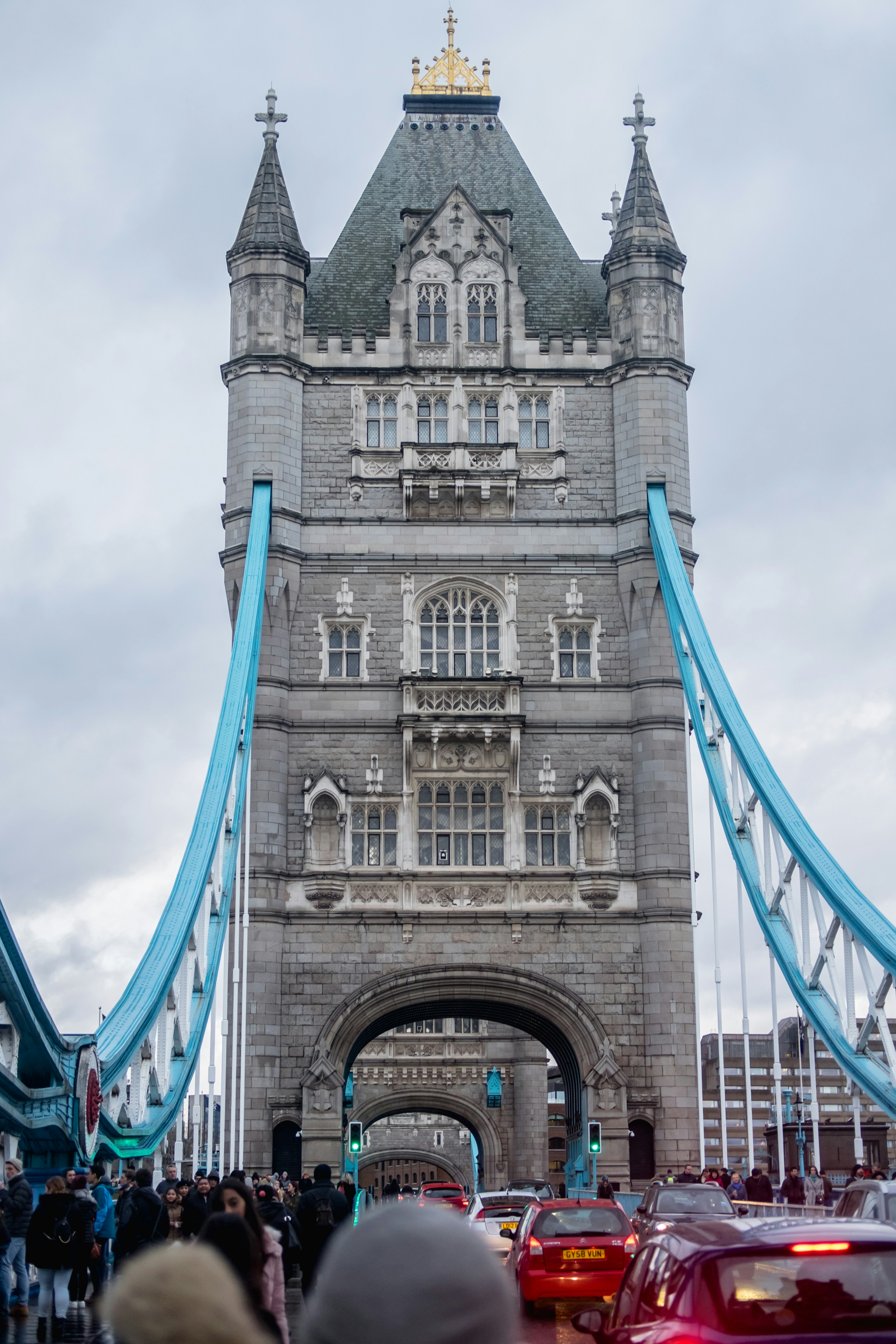 Tower Bridge: Turquoise Cables Framing a Gothic Gate in Transit