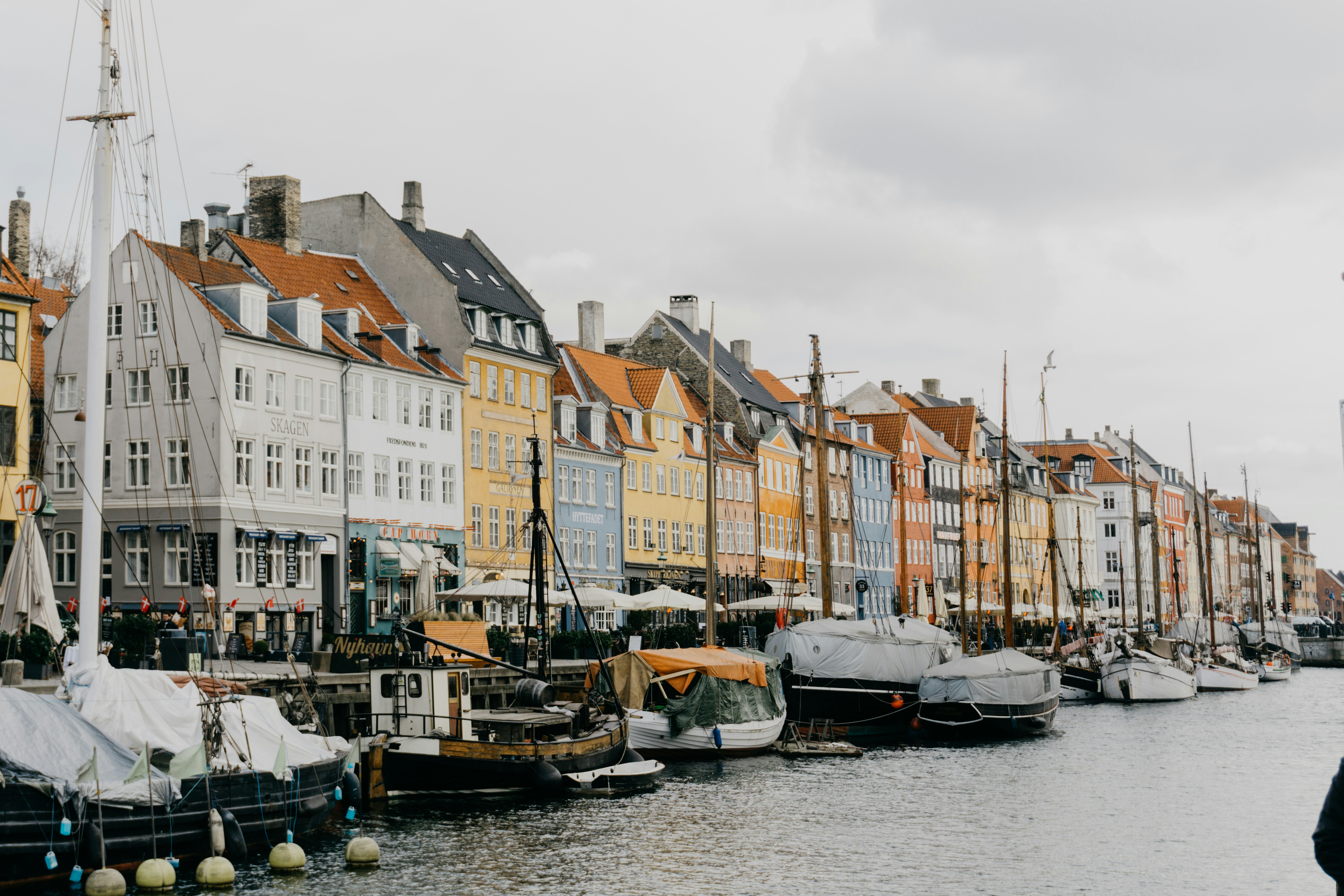 Boat on dock near buildings during daytime photo – Free Denmark Image ...