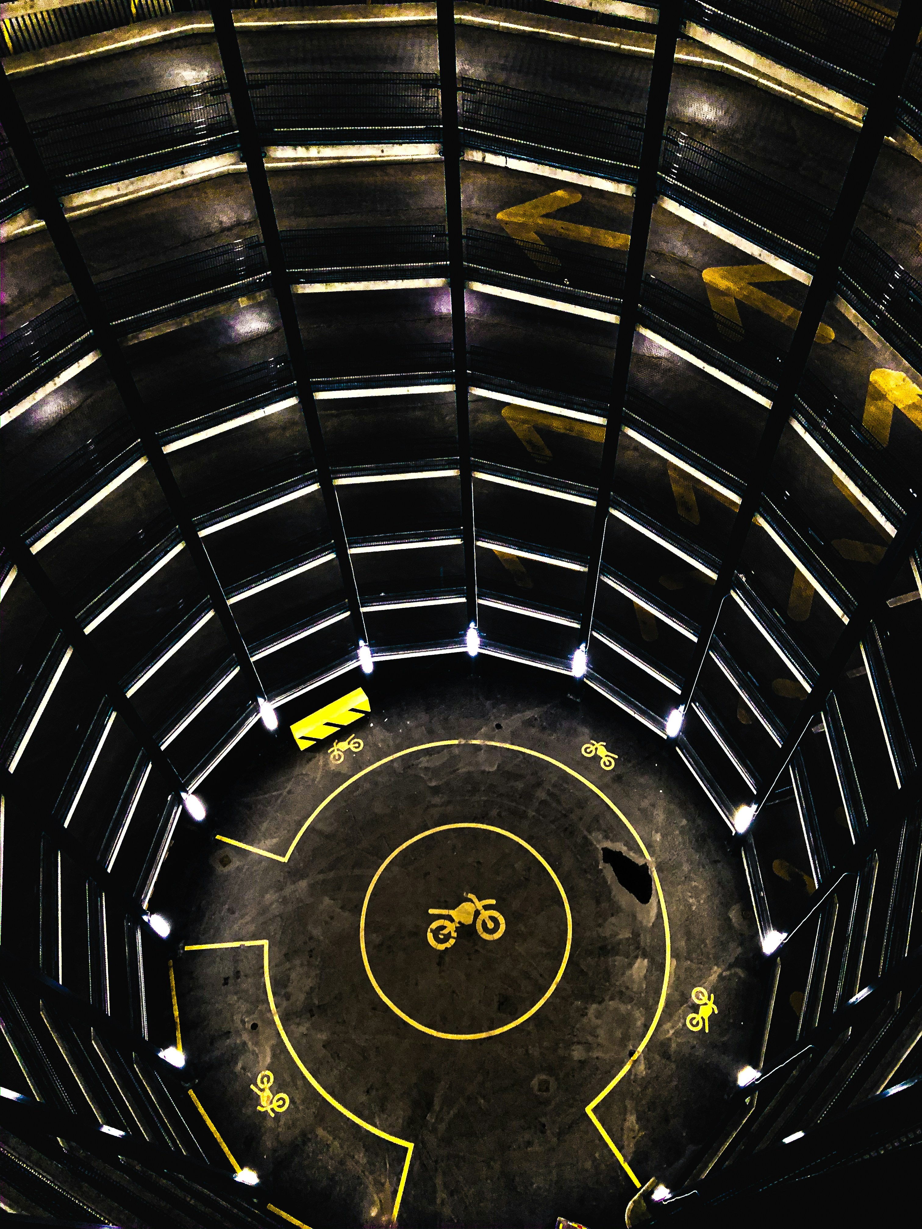 Circular descent: a dimly lit bike-turning shaft