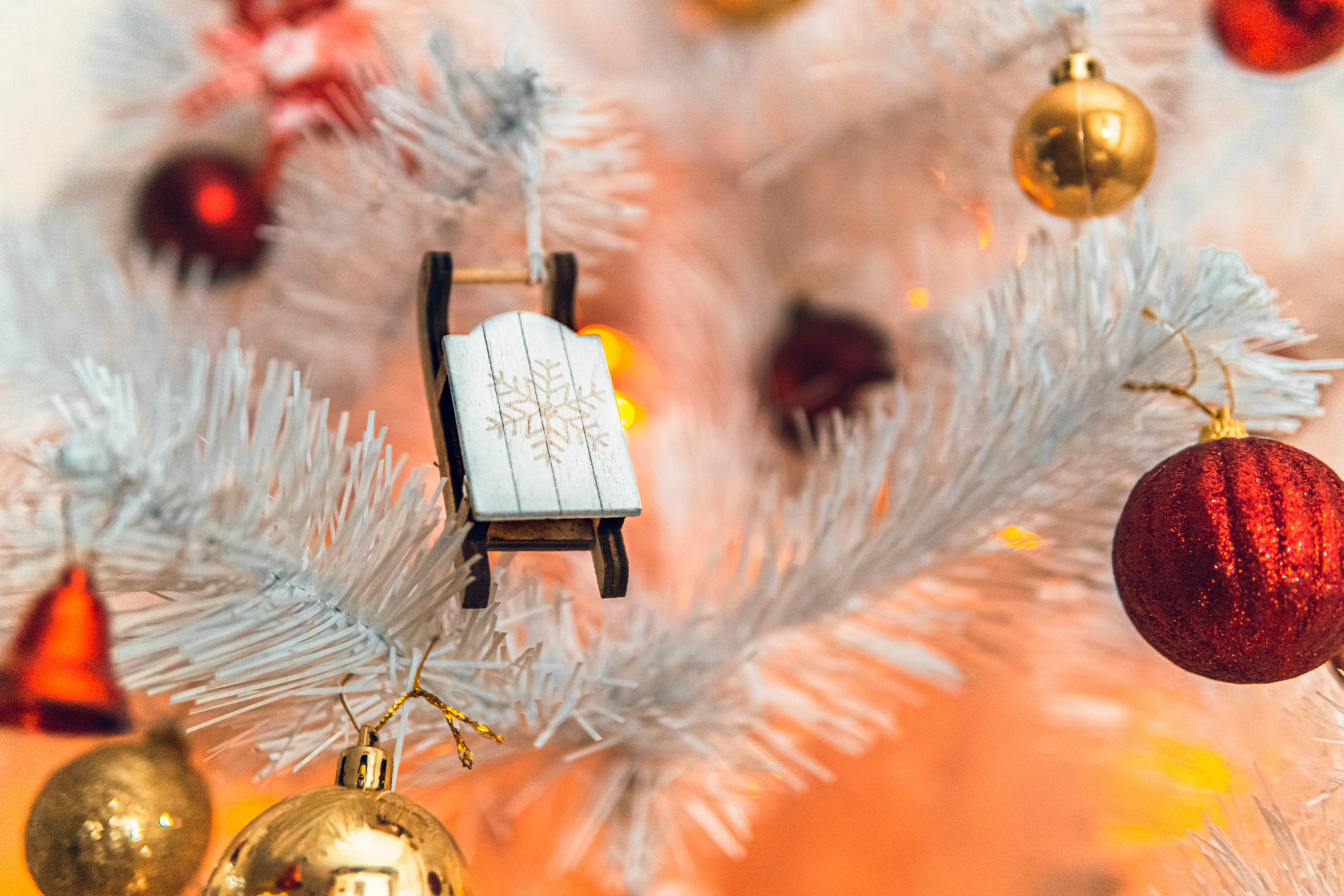 Snowflake Sled Adornment Graces a Frosty Christmas Tree