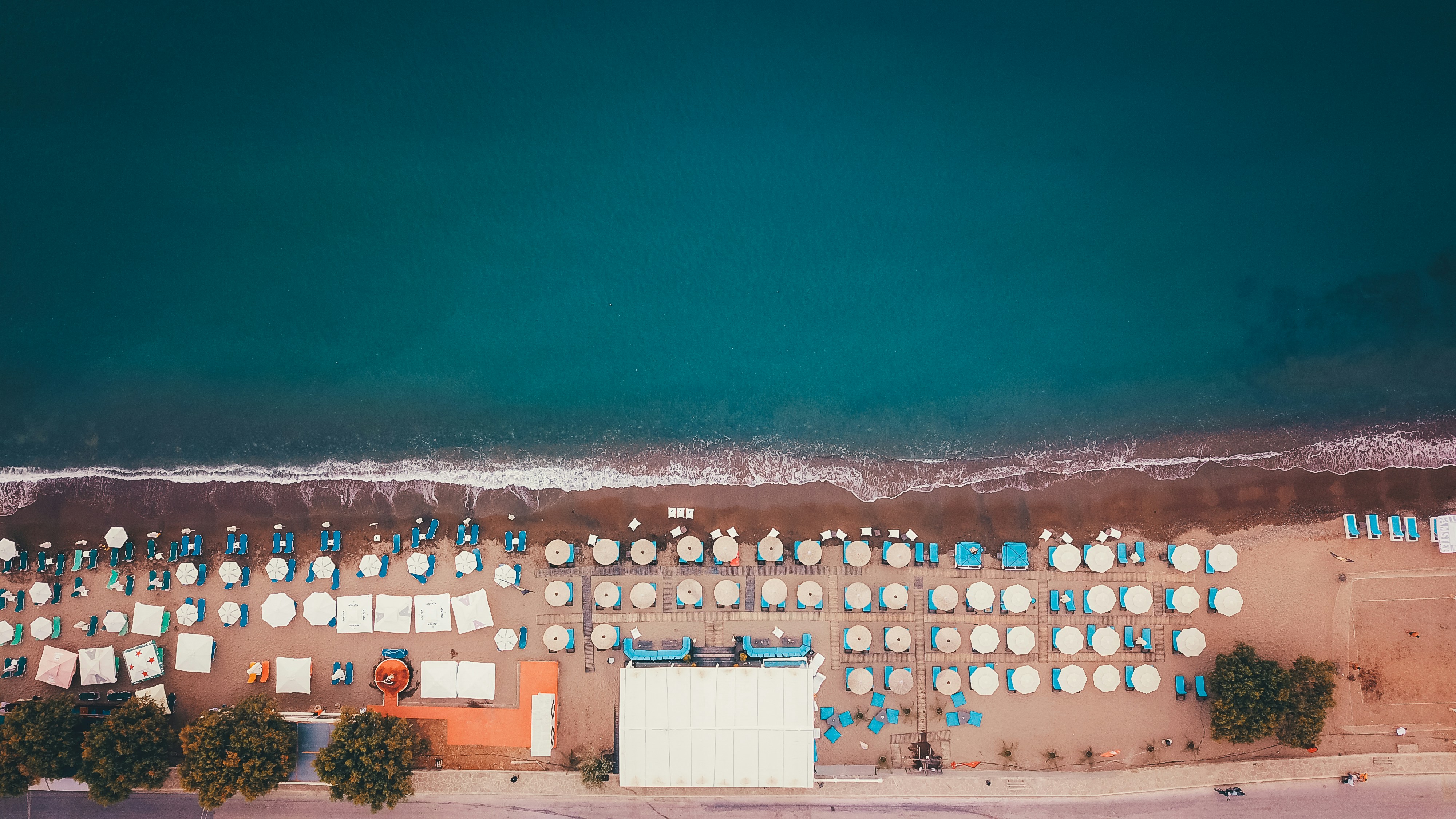 White concrete building near beach during daytime photo – Free Blue ...
