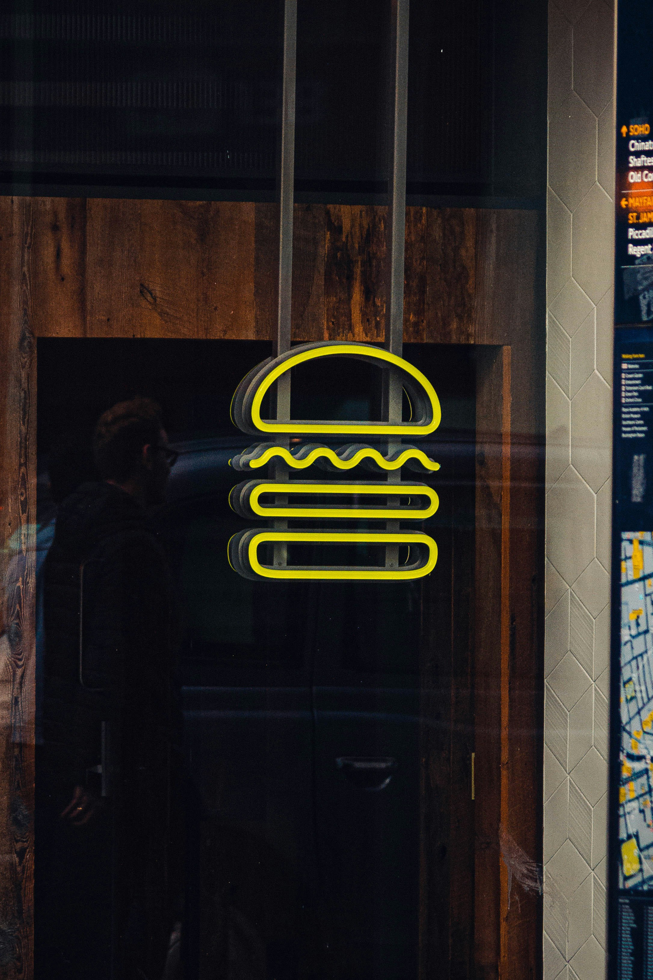 Neon Hamburger Sign Reflected in a Window