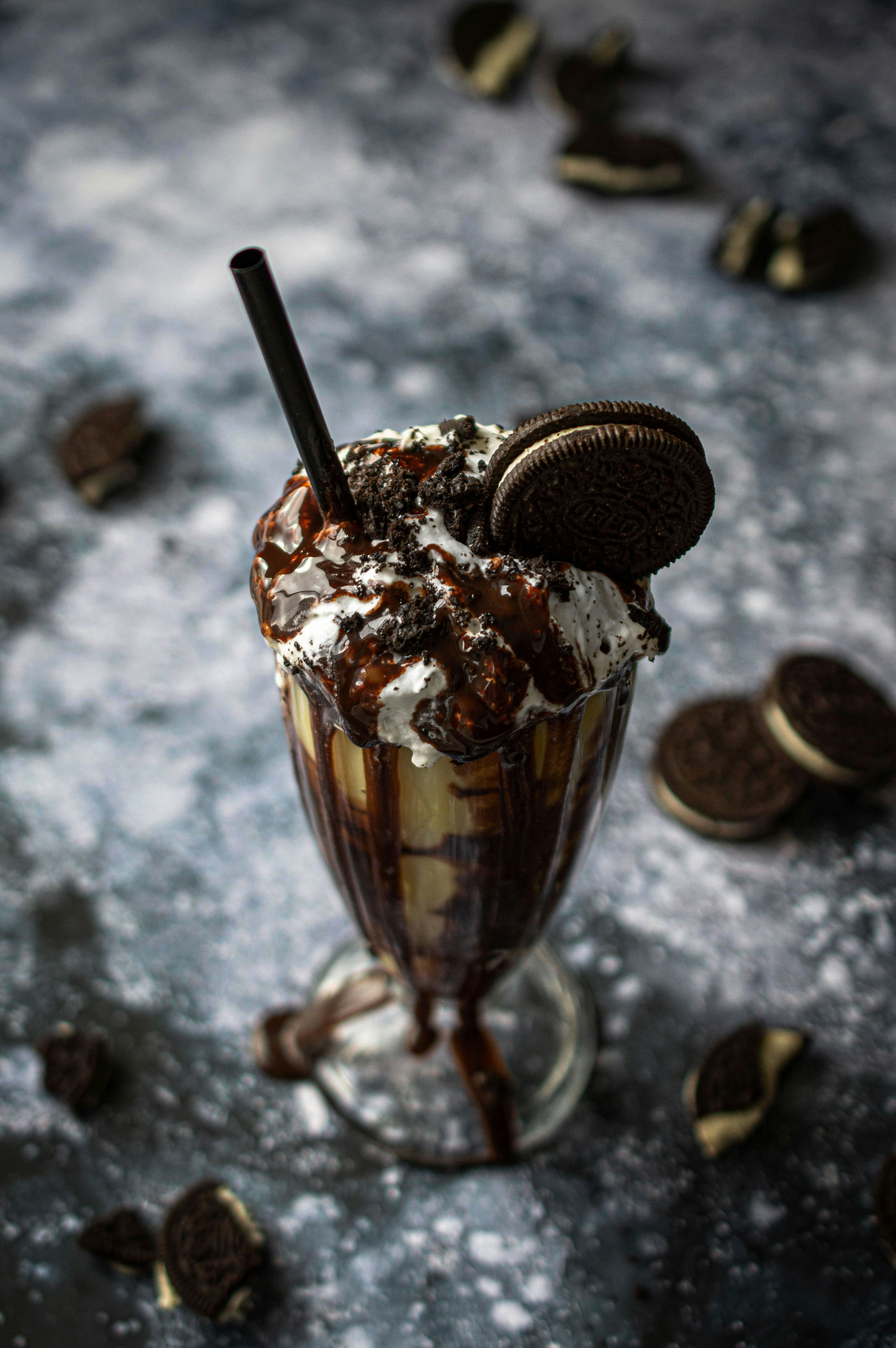 A chocolate ice cream sundae with oreo cookies photo – Free Grey Image ...