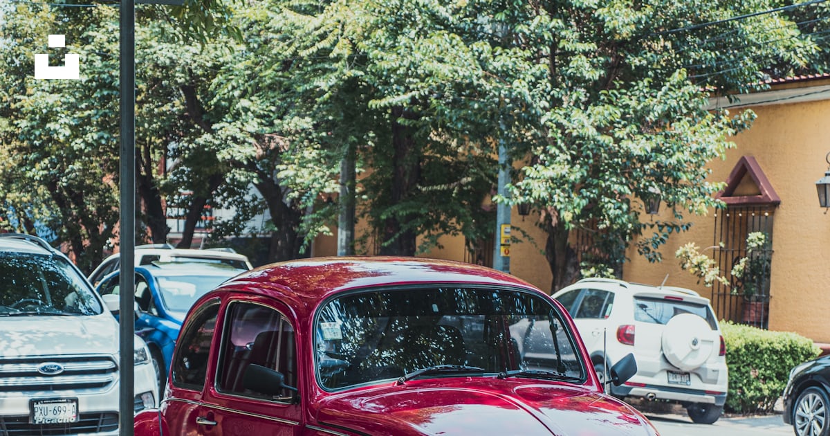 Red Volkswagen Beetle Parked On Sidewalk During Daytime Photo Free