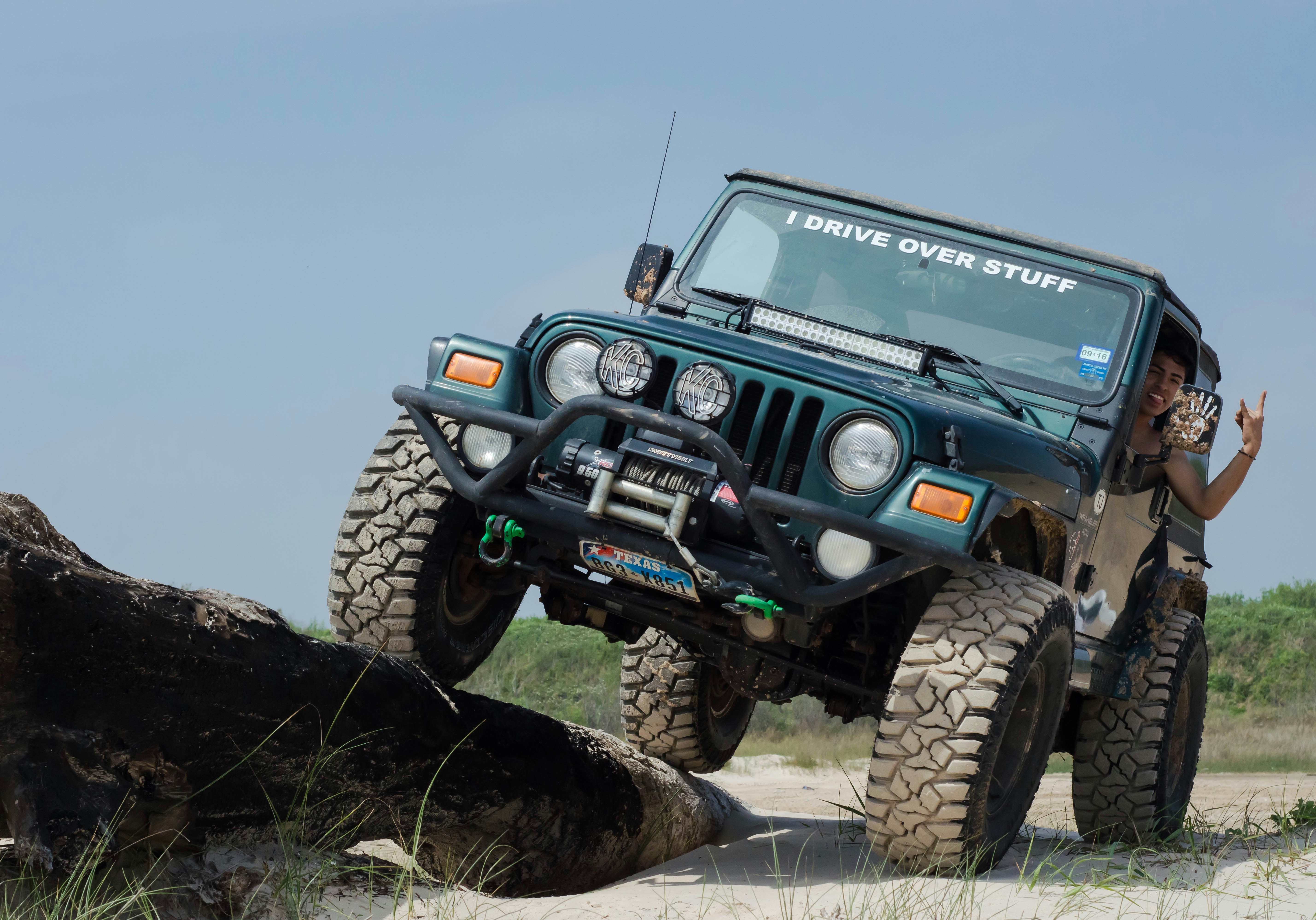 Off-Road Brilliance: Jeep Climbing a Sand Hurdle