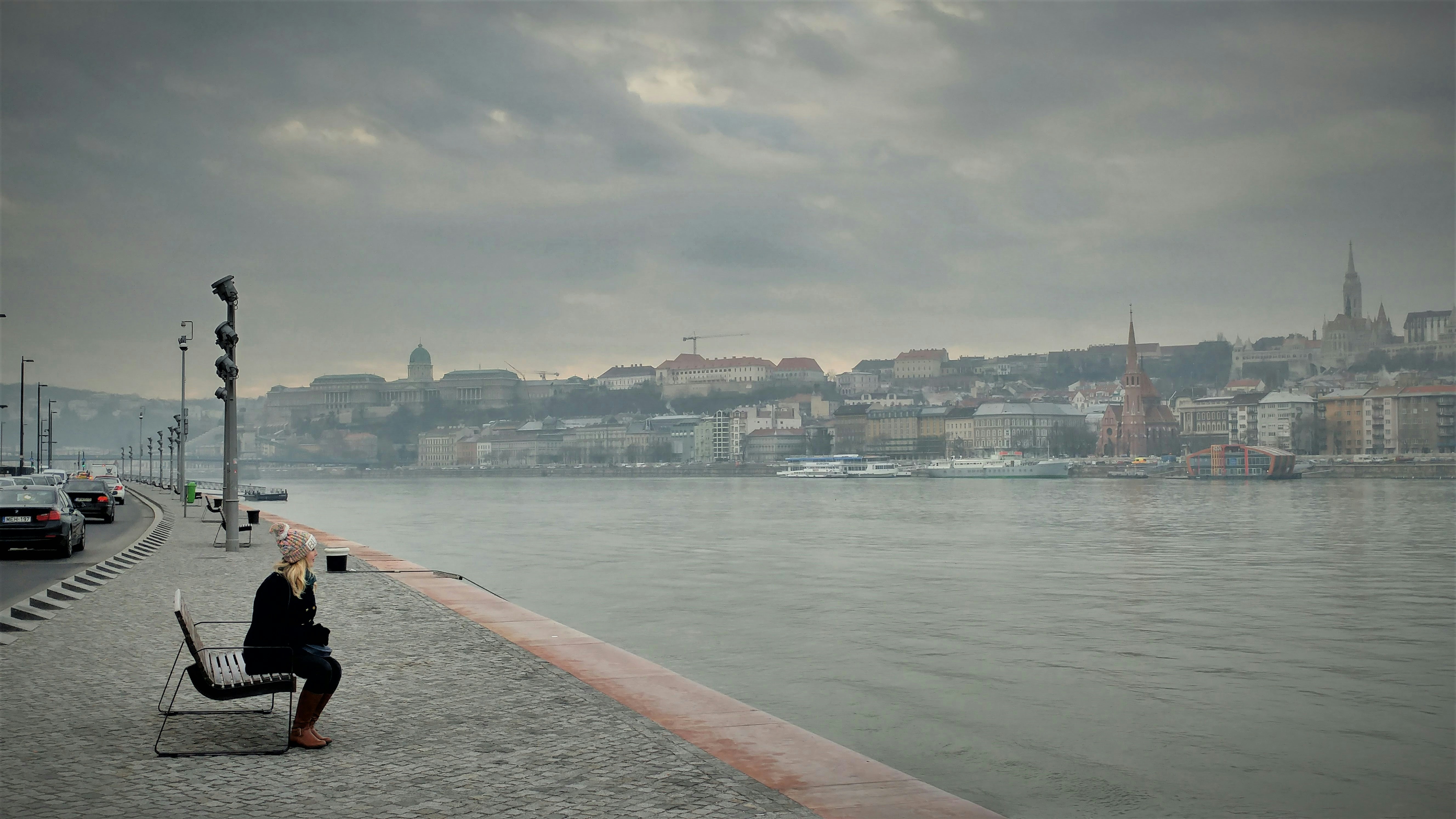 Edge of Calm: A Solitary Moment on the Danube Promenade