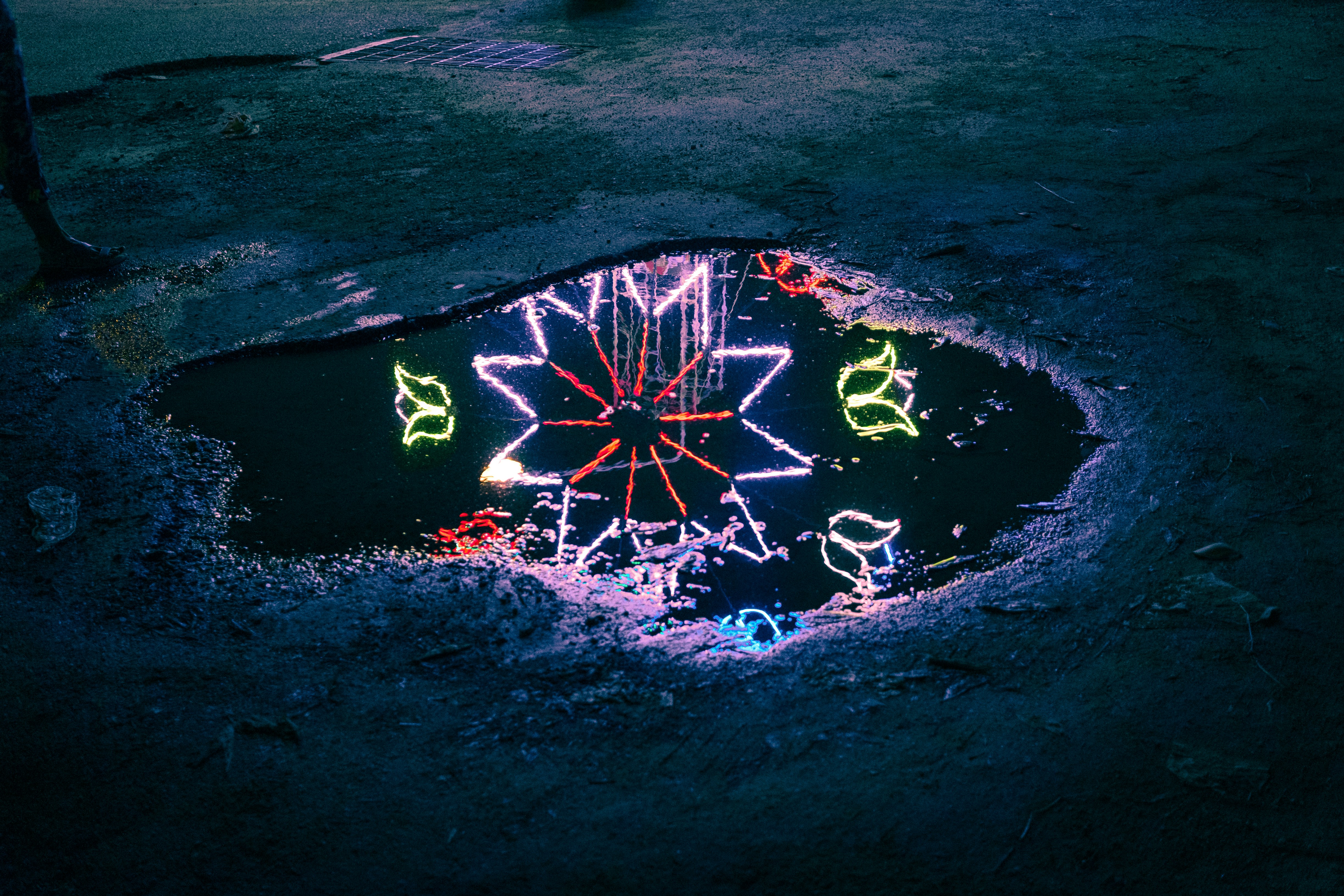 At The Fairground | aerial view of people riding on boat on water during daytime
