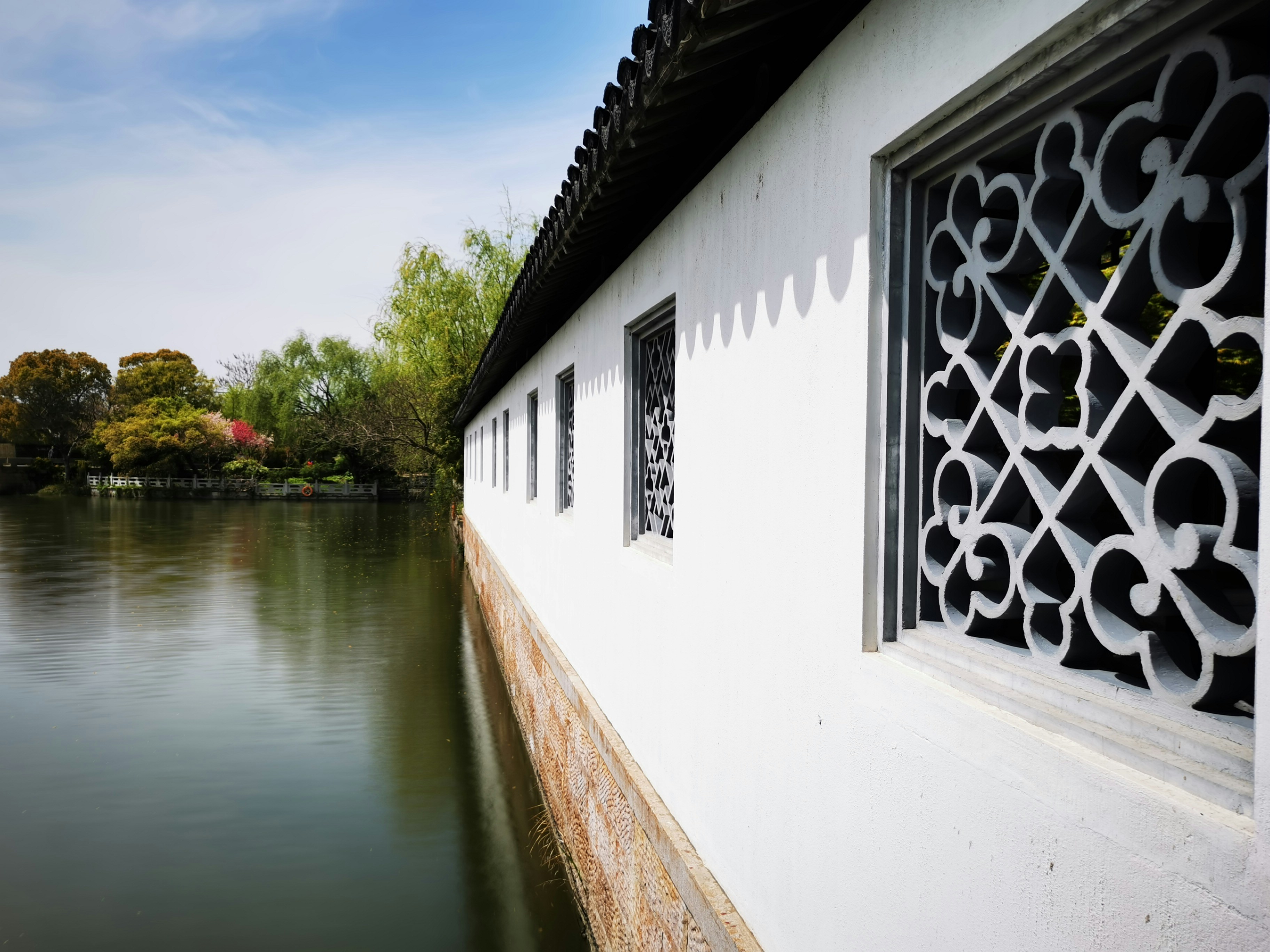 White concrete building near body of water during daytime photo – Free ...