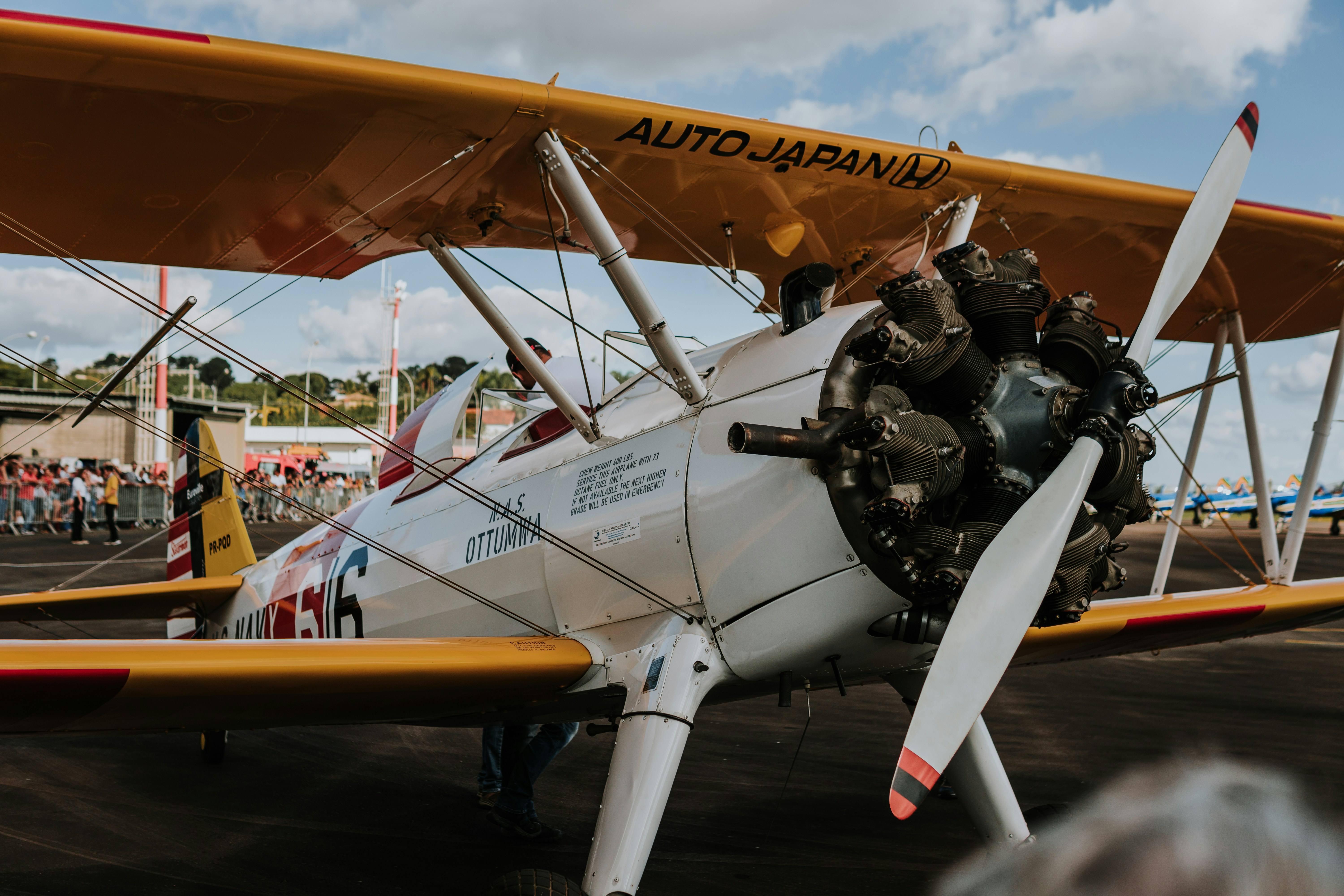 Sunlit radial beauty: a vintage Auto Japan biplane on display