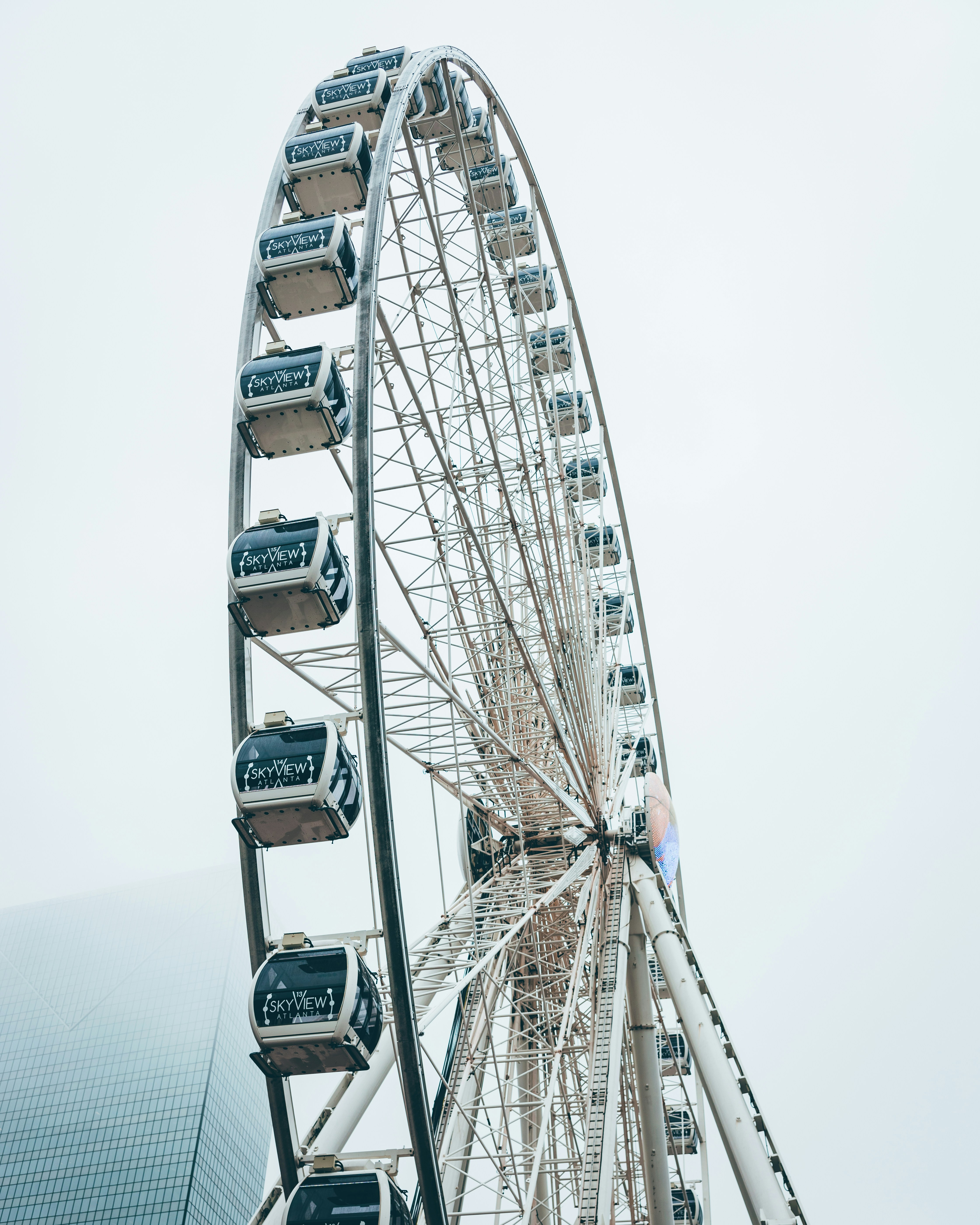 ferris wheel under white sky during daytimeOsarugue Igbinoba