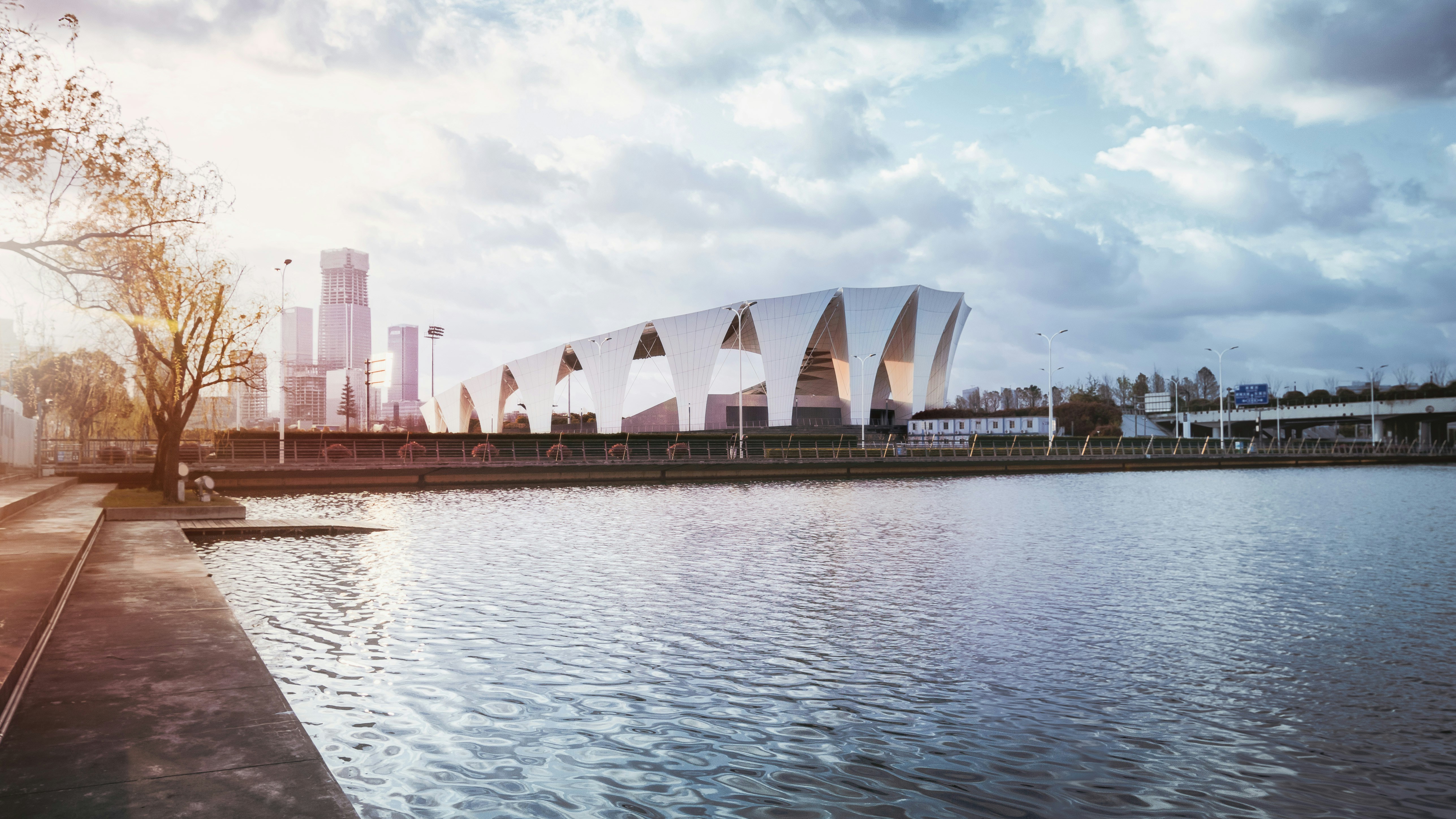 Dawn on the Sail-Arches Waterfront: A Modern Riverside Skyline