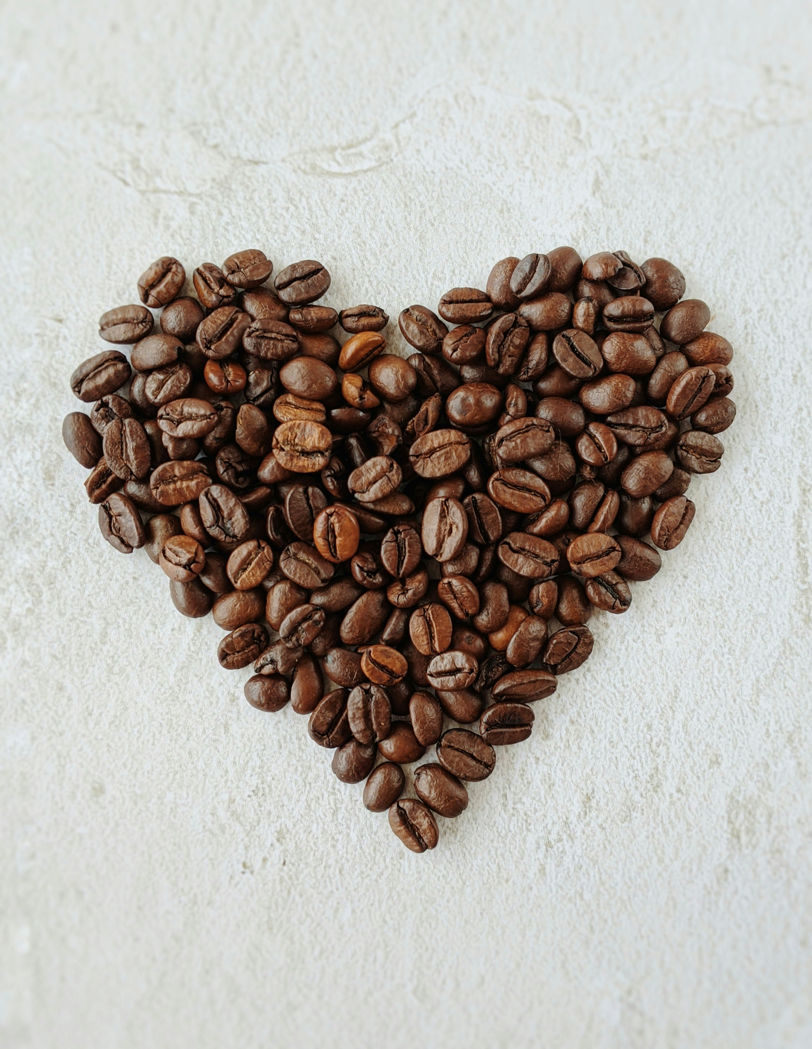 Bean Heart on Pale Canvas: A Macro Portrait of Warmth and Texture