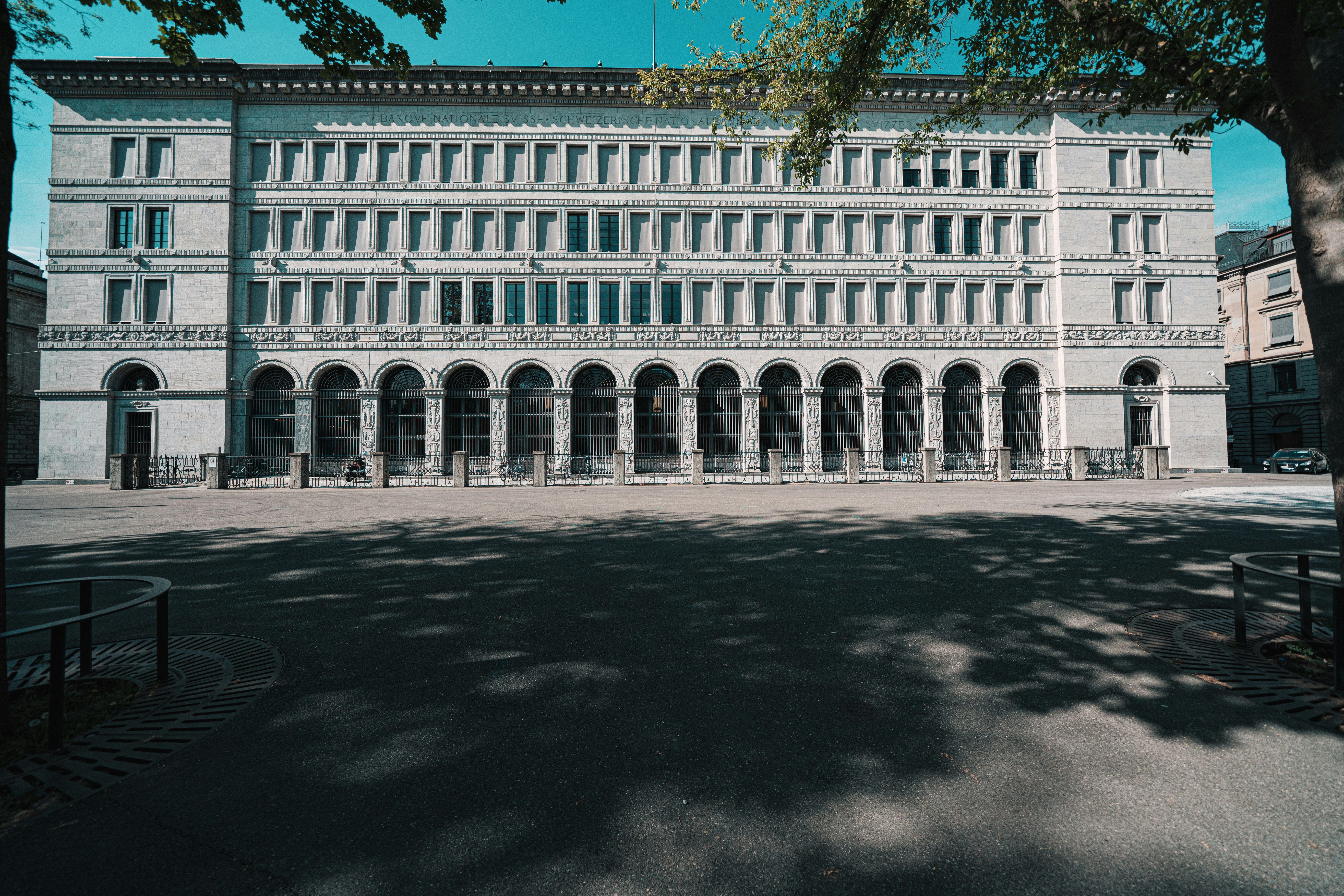 Arched Echoes: Symmetry and Shade in a Sunlit Plaza