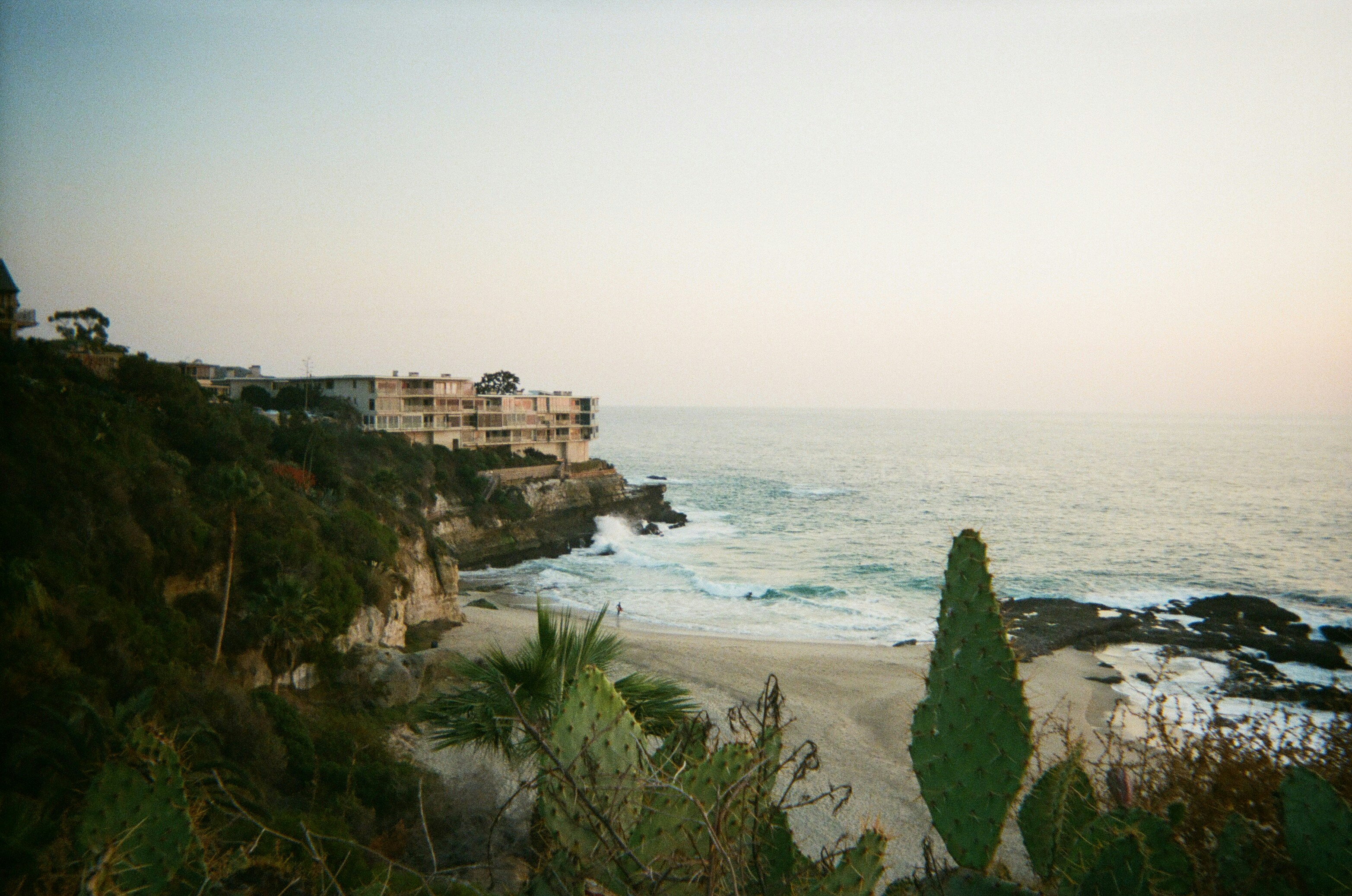 White concrete building near sea during daytime photo – Free Laguna ...