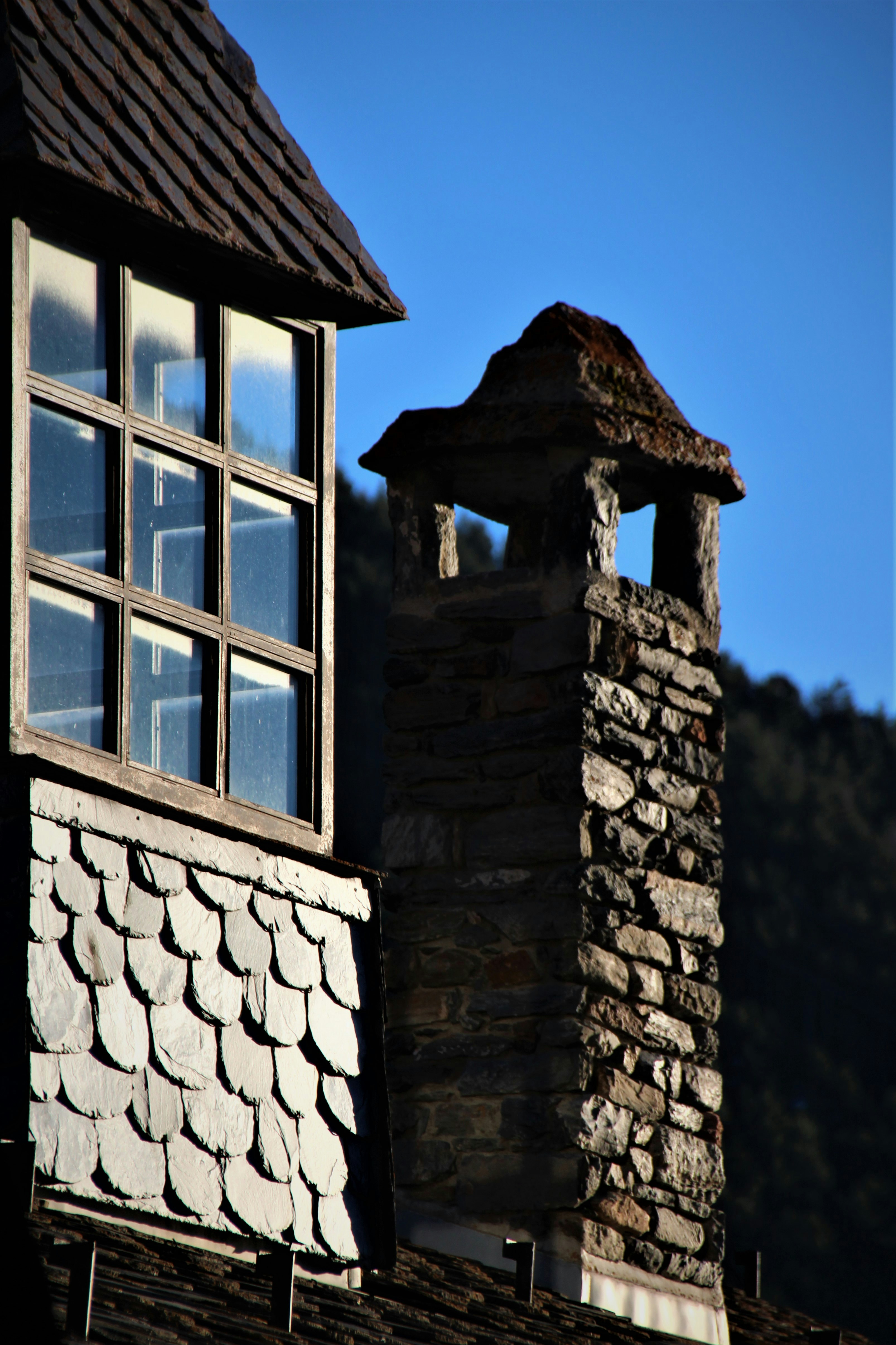 brown brick wall with glass window