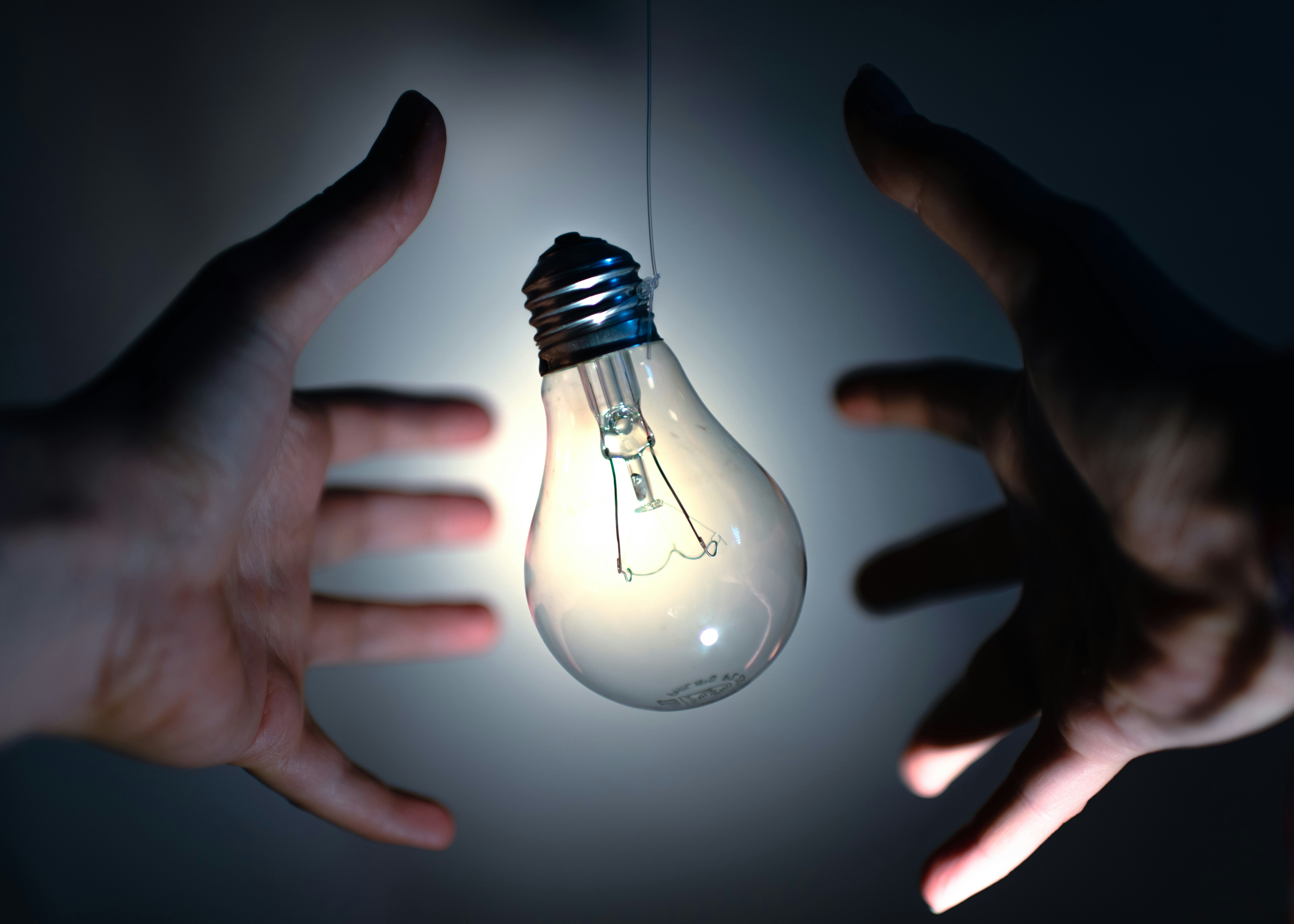 Light bulb on persons hand photo – Free Grey Image on Unsplash