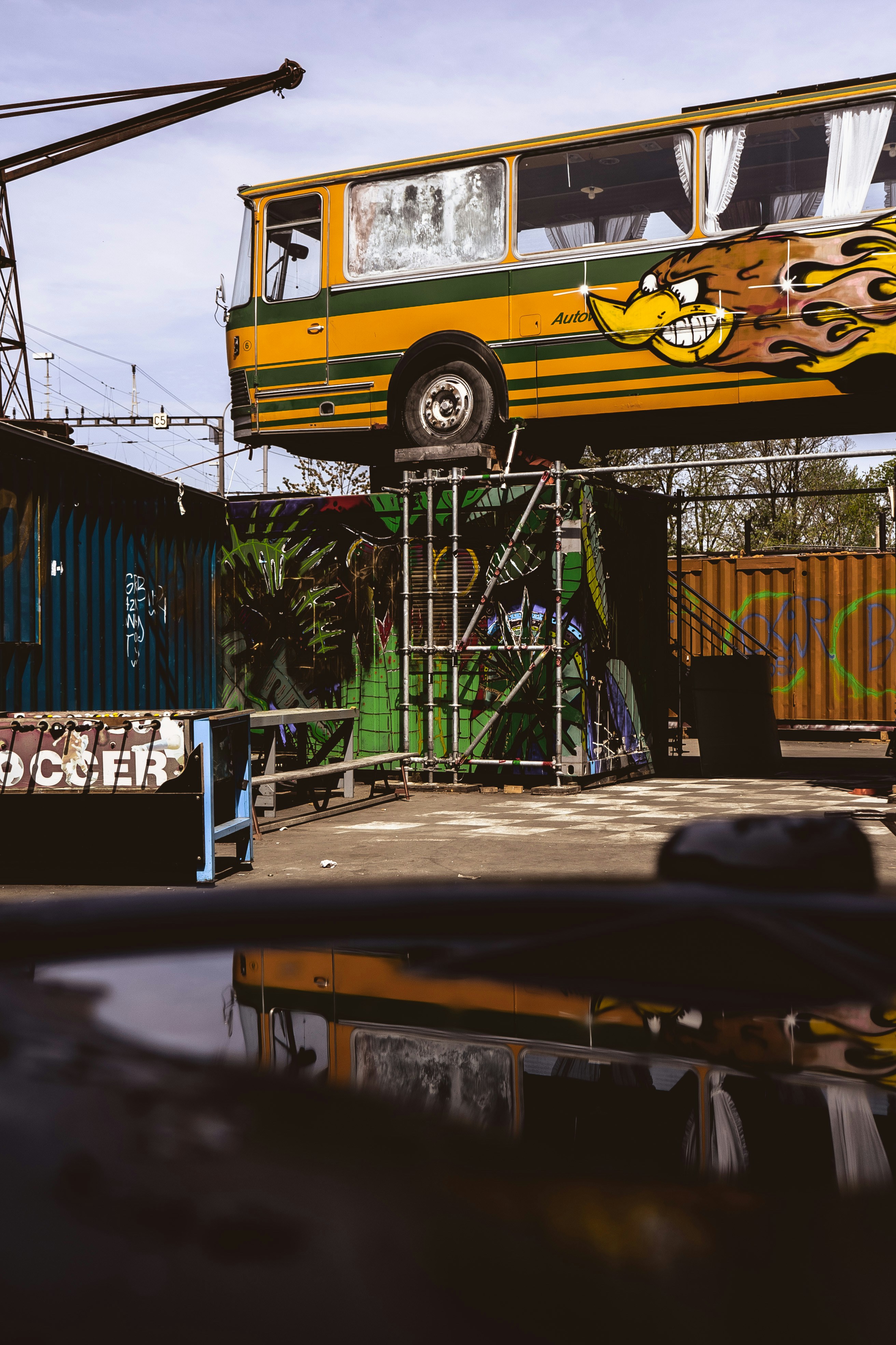 A bus that is sitting on top of a platform photo – Free Bus Image on ...