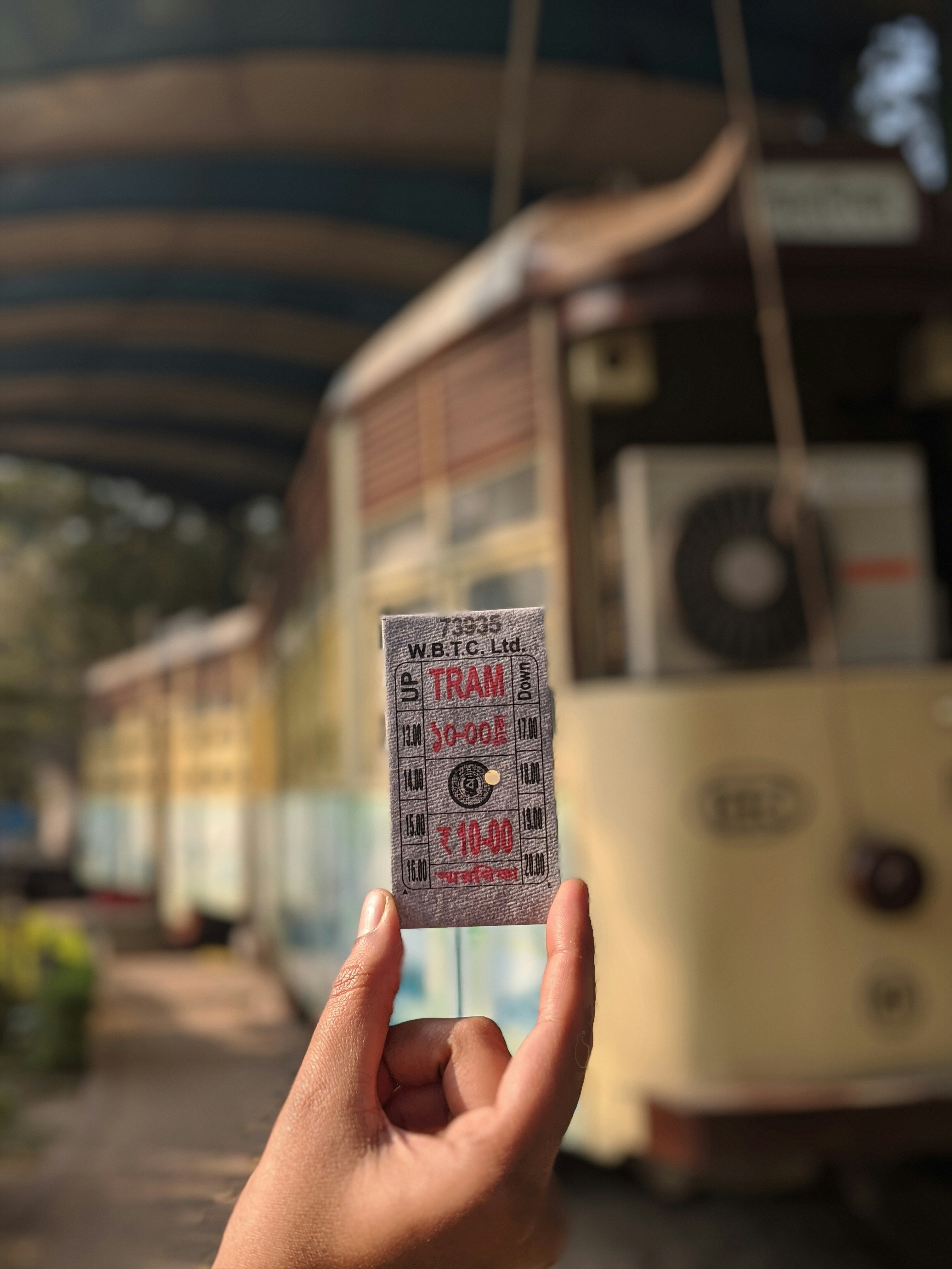 Tiny Ticket, Big Moment: A Hands-On Memento in Front of a Vintage Tram