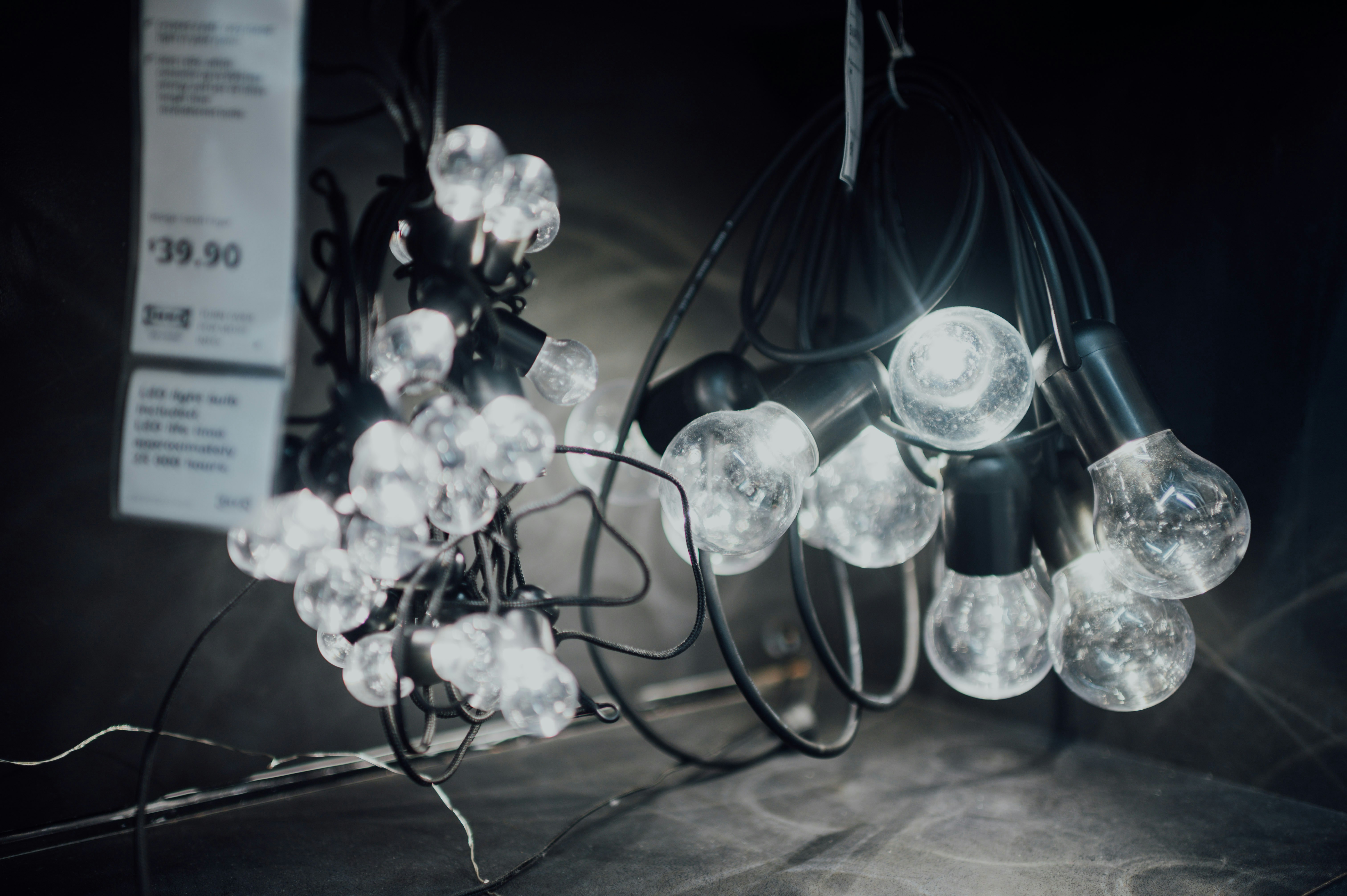 Twisted Glow: A Cluster of Bulb Fairy Lights Looped on a Dusk Stage