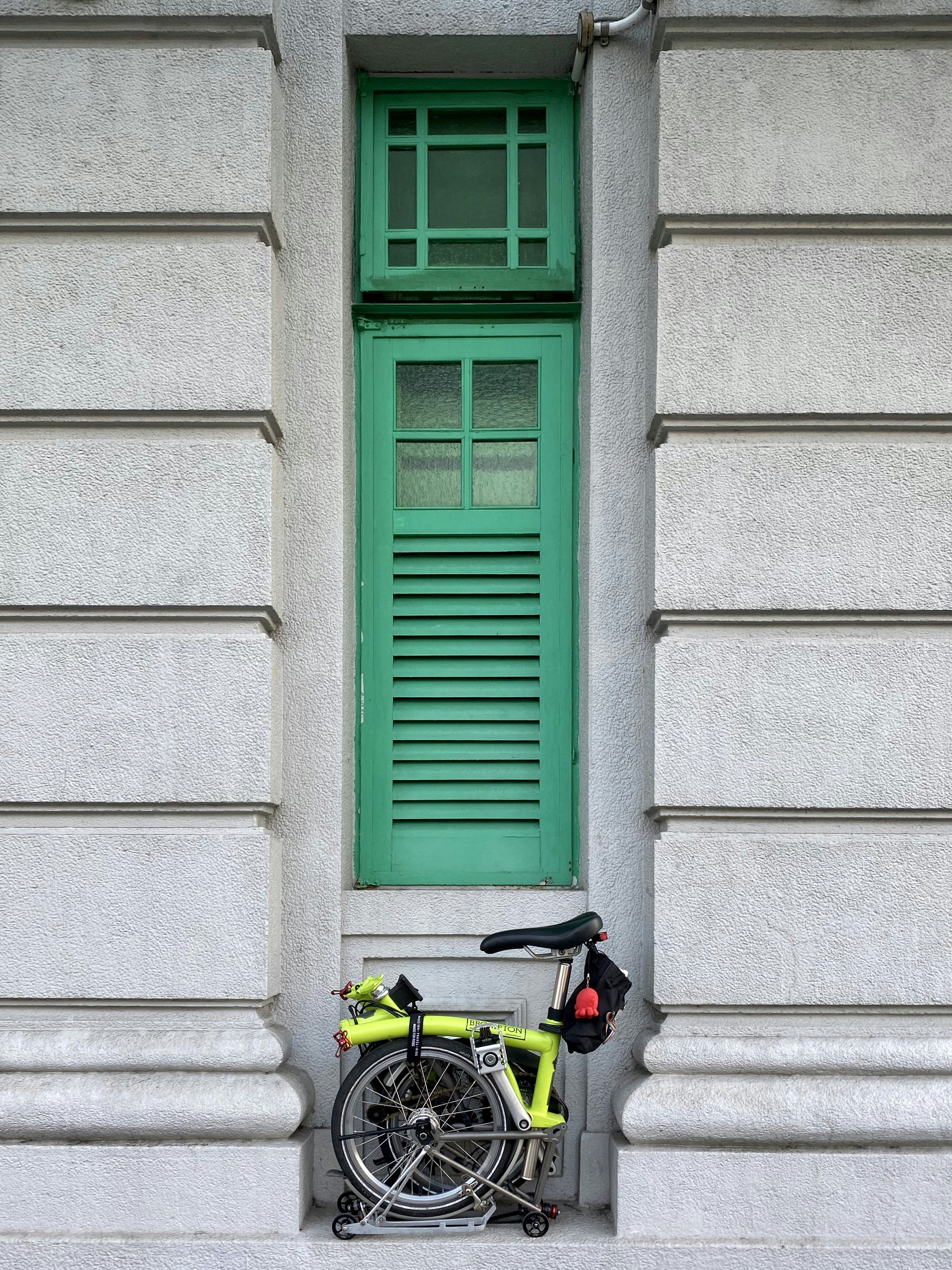 Emerald Doorway and Lime Bicycle: A Quiet Symmetry in Stone
