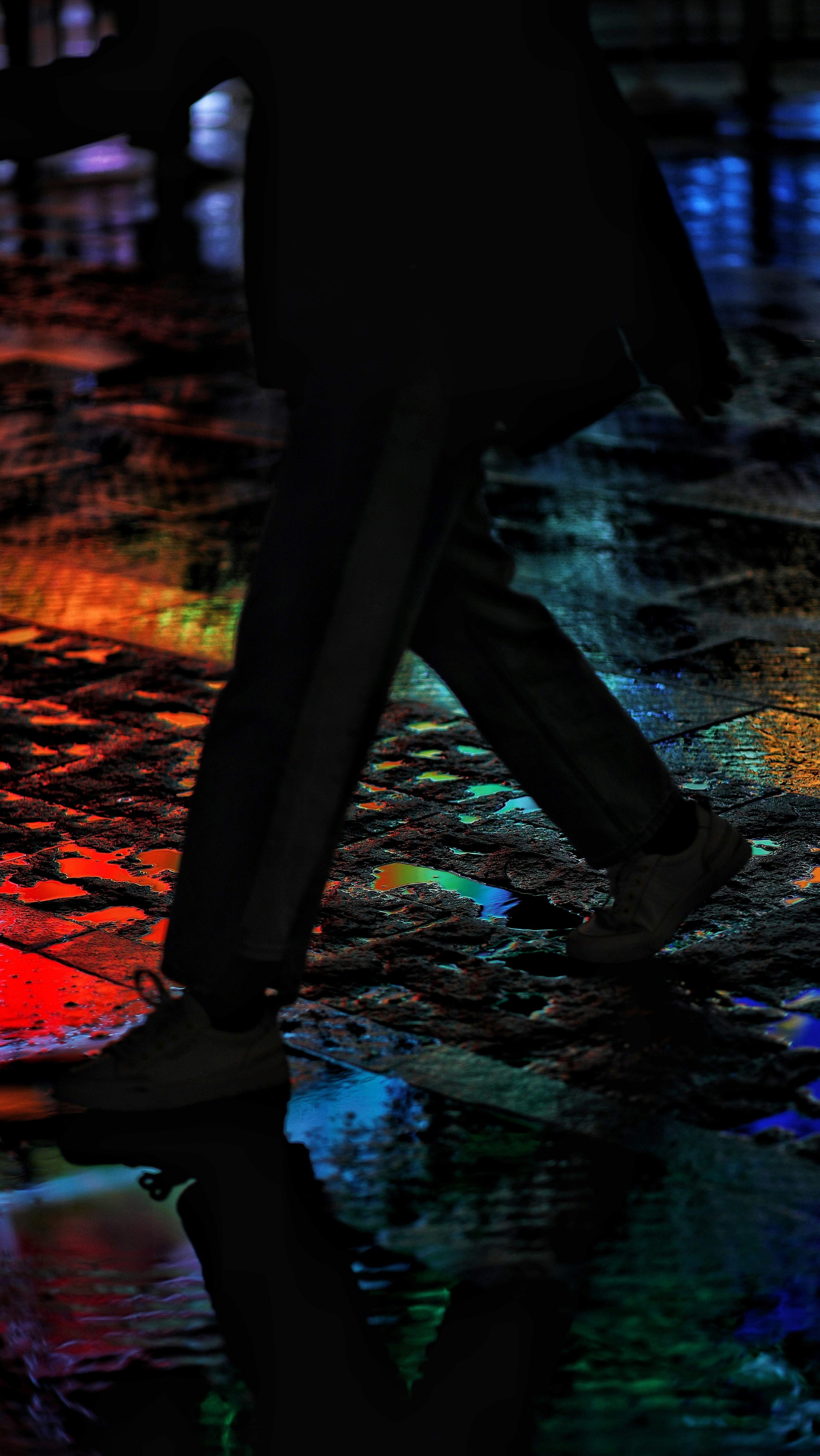 Neon Footfalls Across a Rain-Slicked Street
