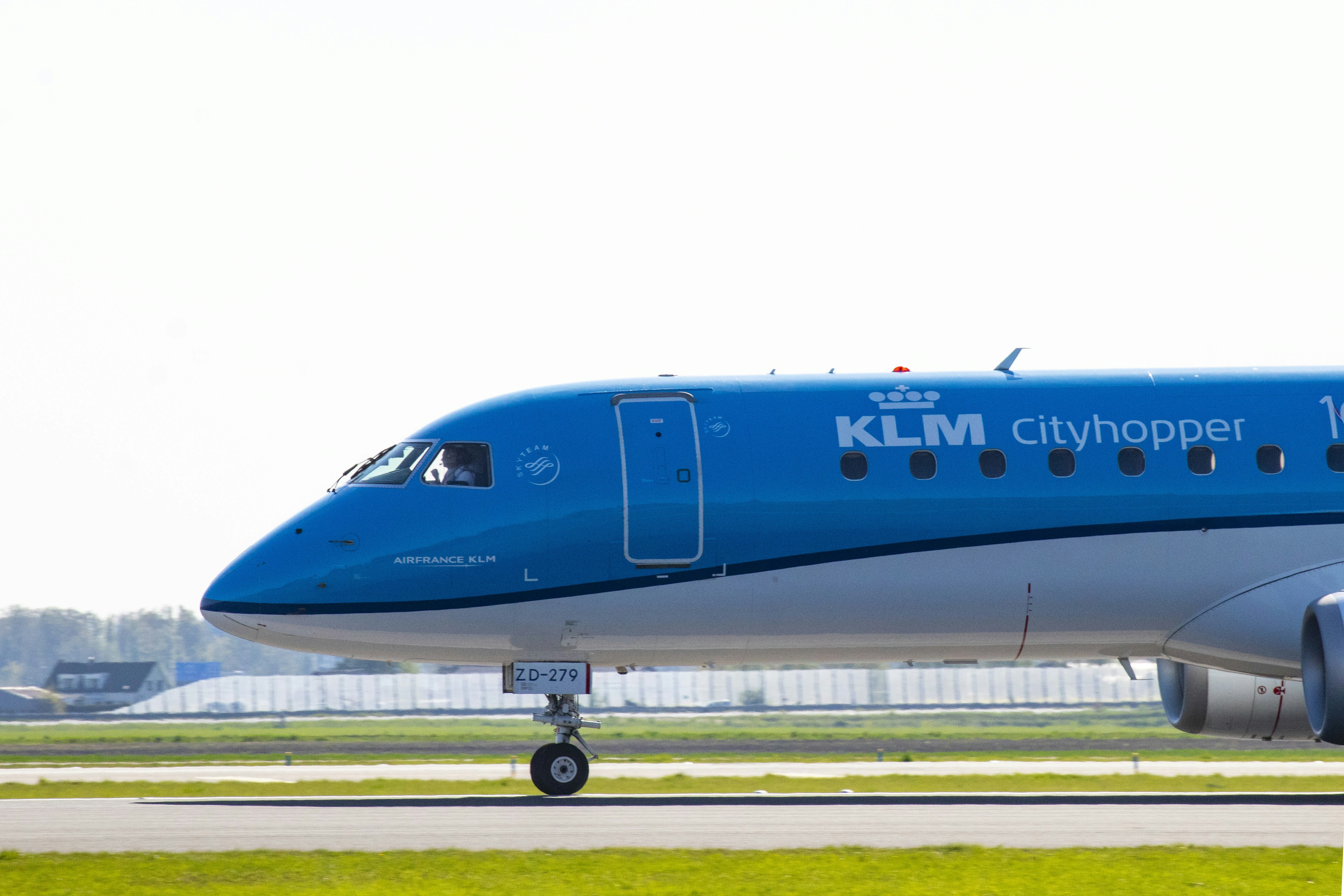 Blue and white passenger plane on airport during daytime photo – Free ...