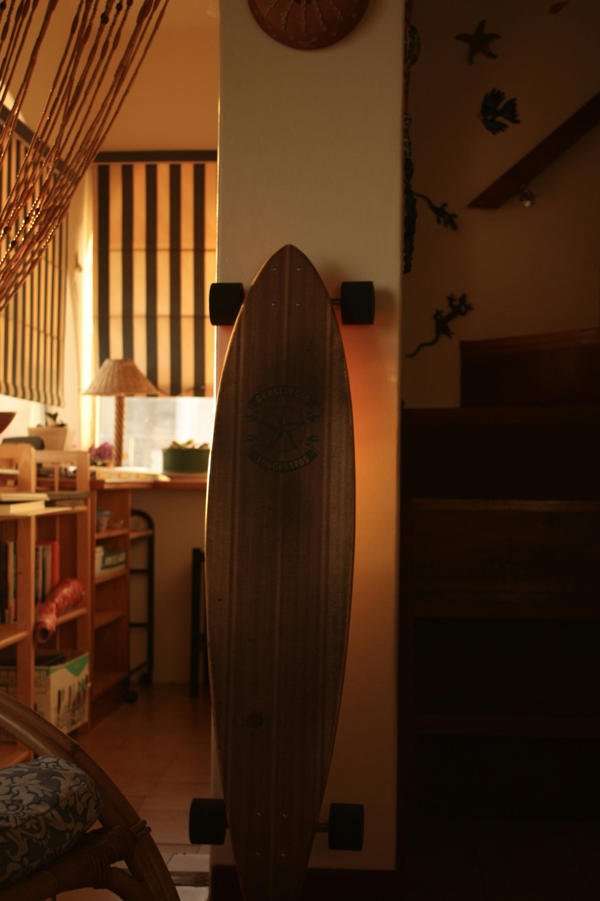 I was sitting in the living room of the beach house we were renting when I saw the reflection off the back of my longboard so I decided to take a picture.