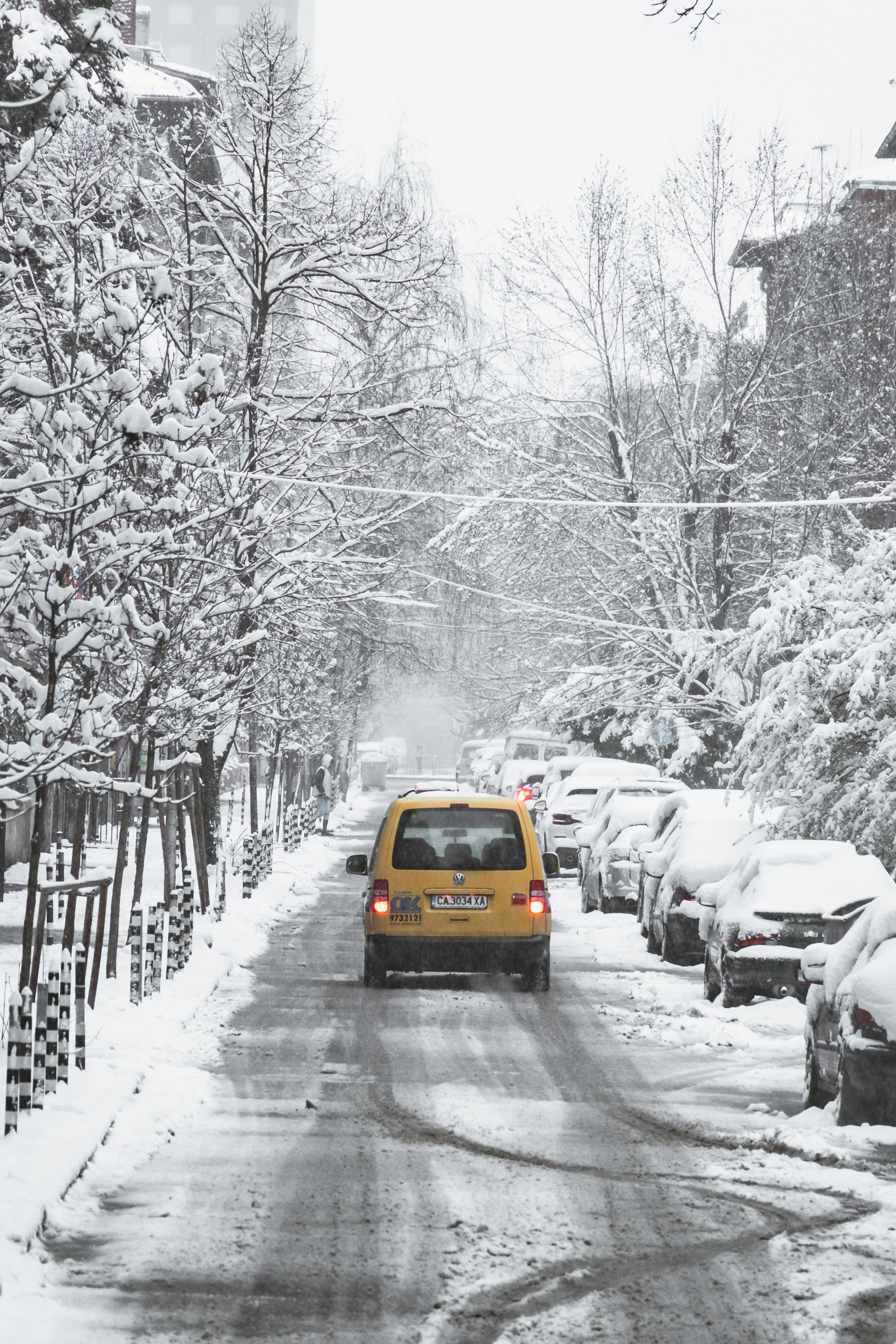 Yellow Cab Traverses a Snowbound Avenue
