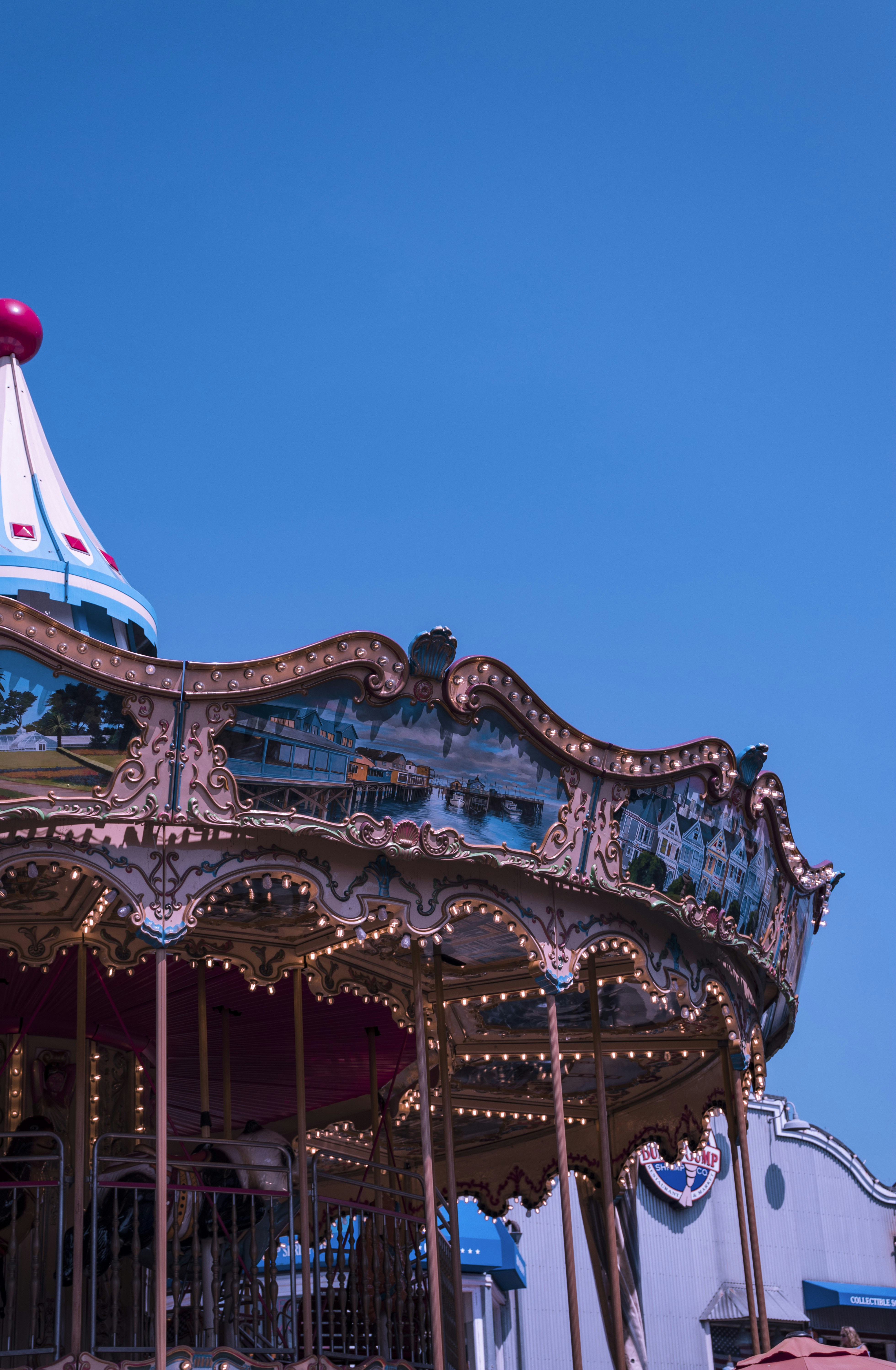 White and red carousel under blue sky during daytime photo – Free Blue ...