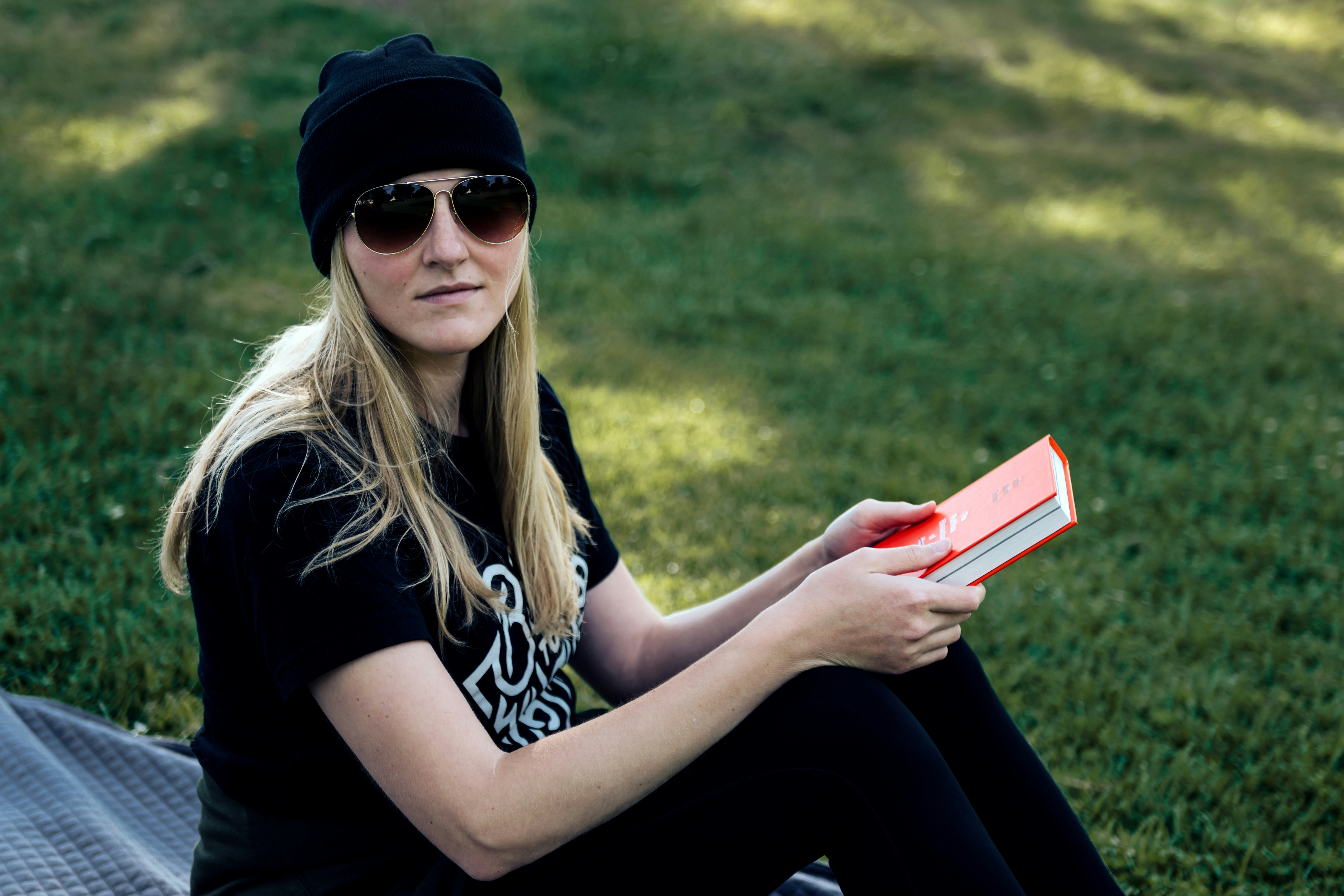 Red Book, Calm Gaze: An Afternoon Portrait on the Lawn