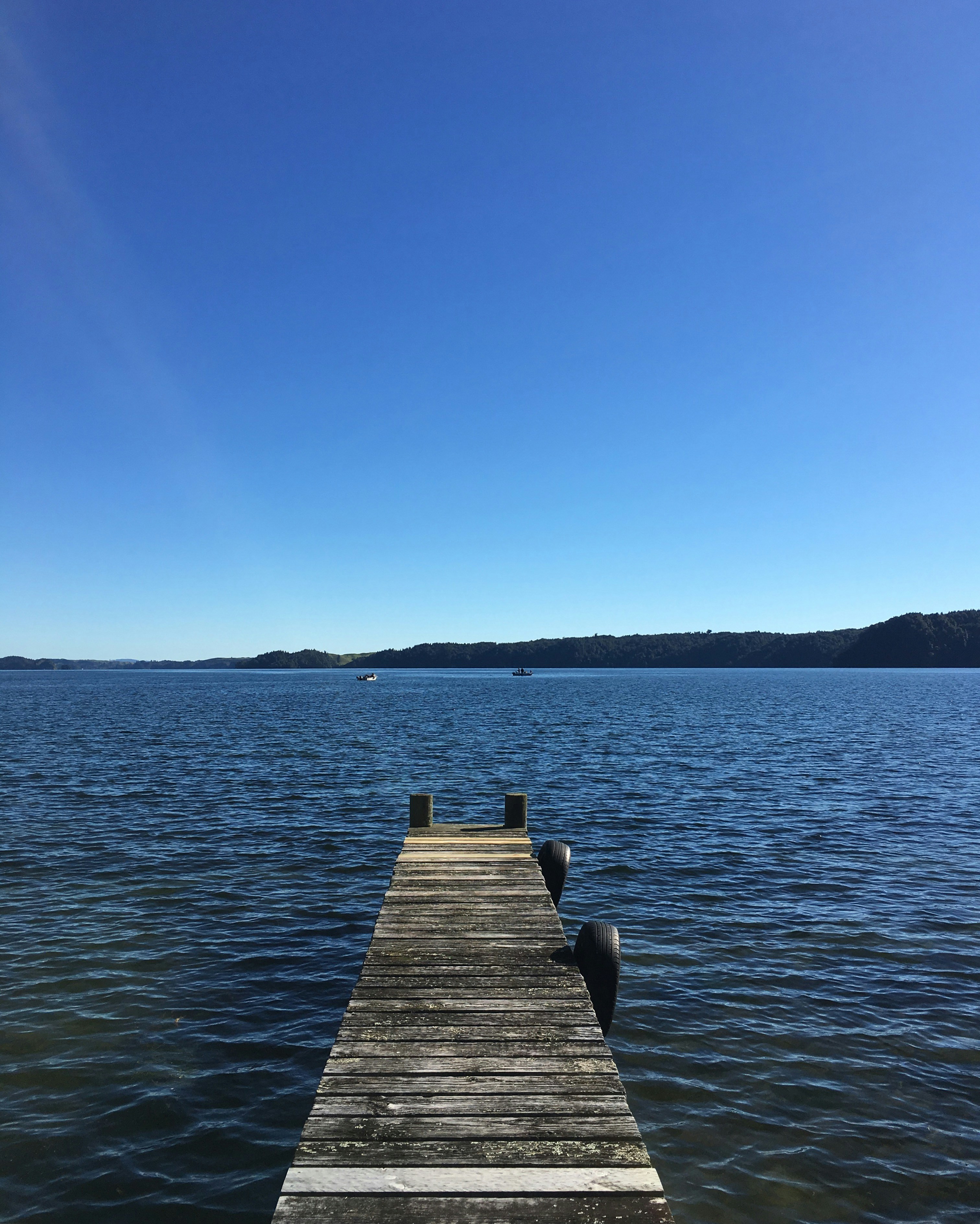 brown wooden dock on sea during daytime
